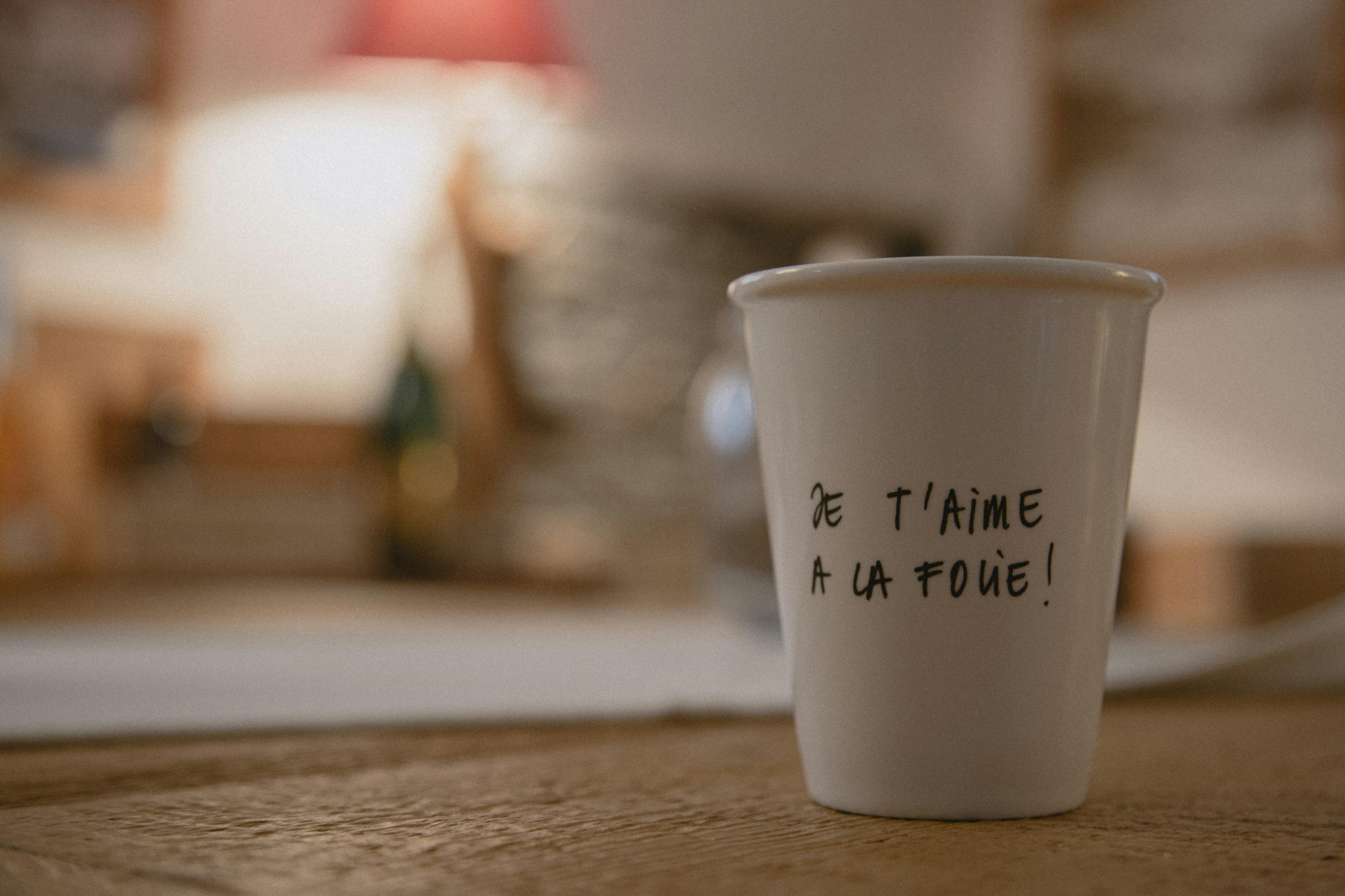 Whispered Message on a Ceramic Cup in a Quiet Kitchen