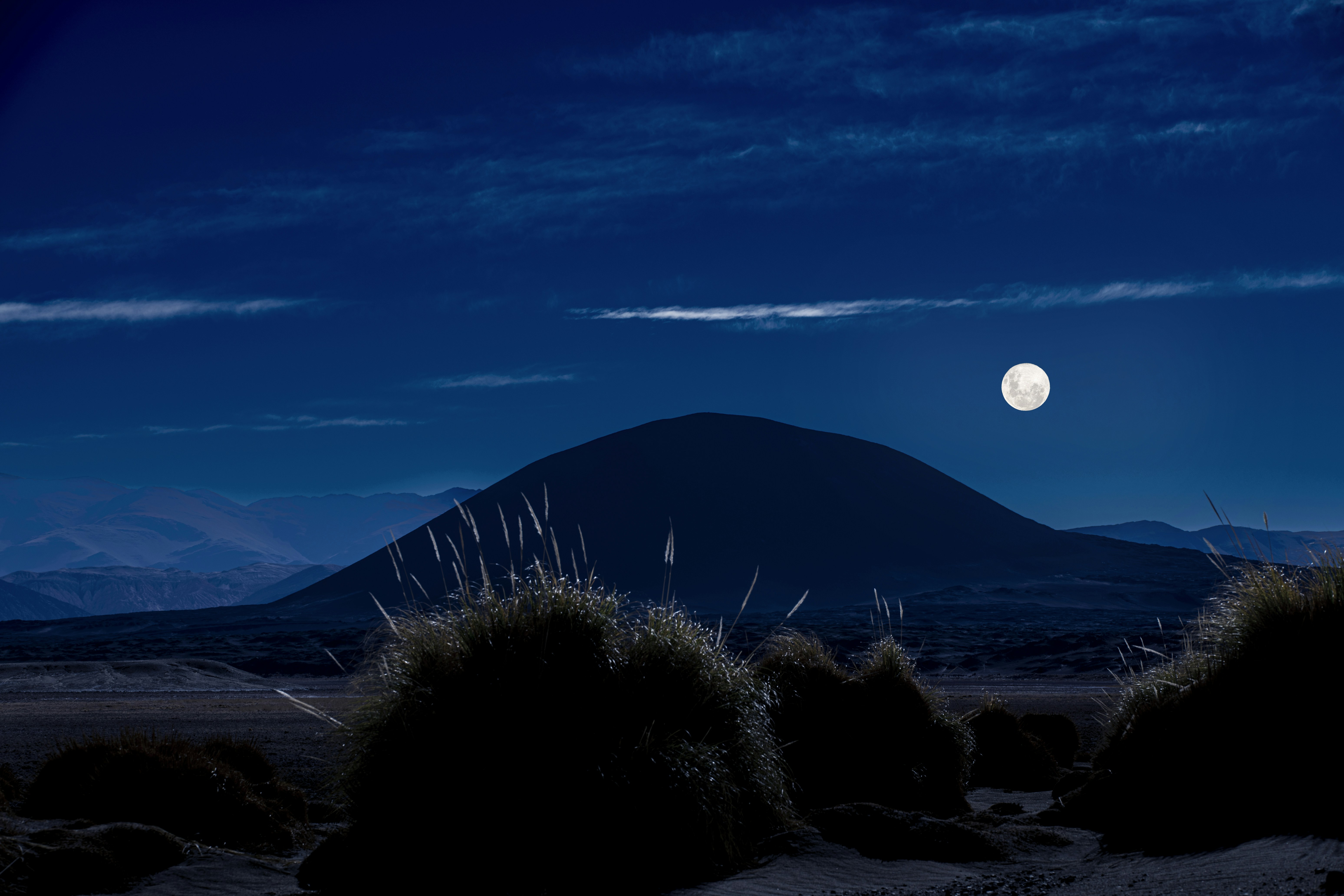 Moonlit Dune silhouette over a quiet desert horizon