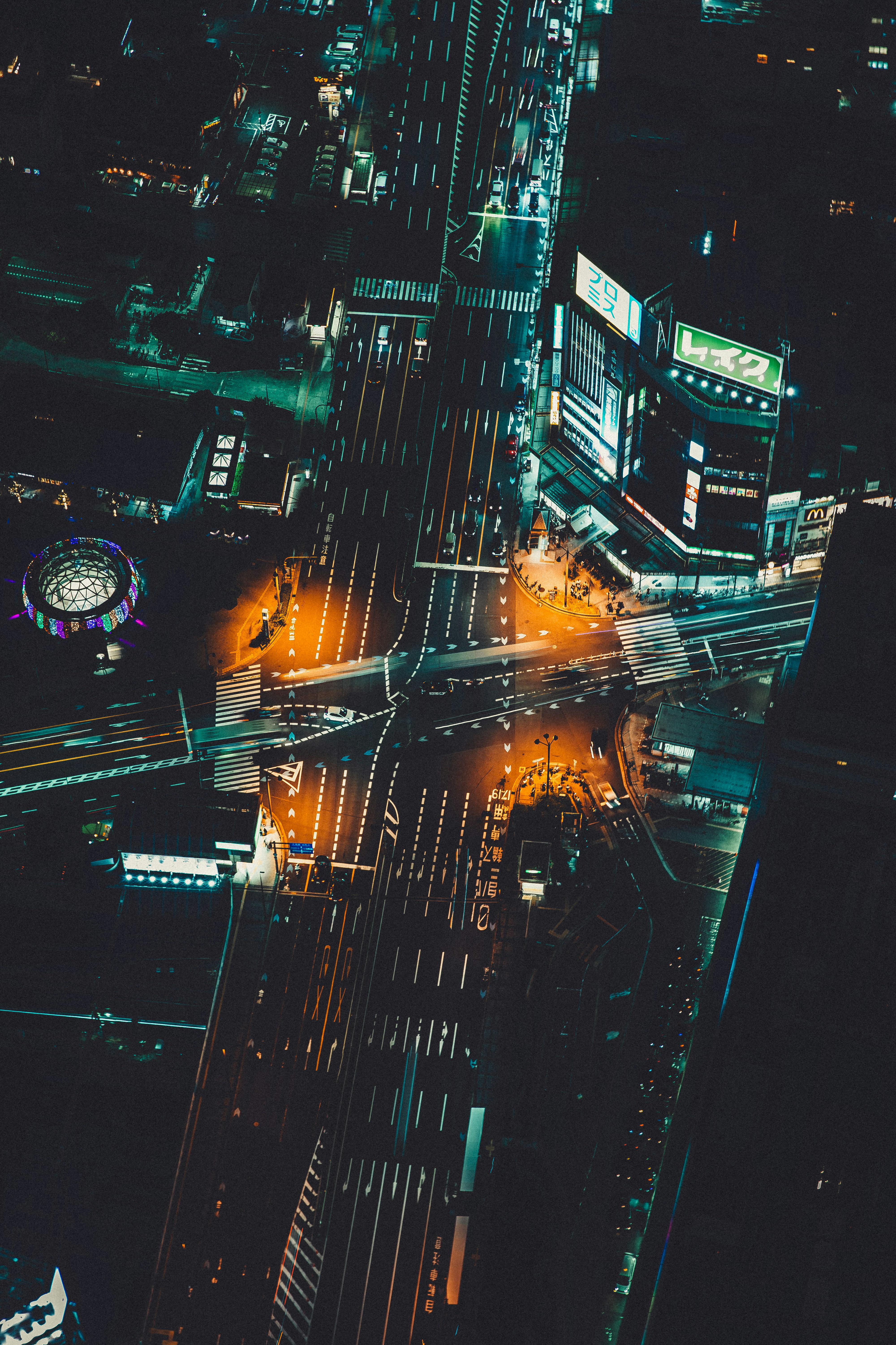 Neon Crossroads: A Bird’s-Eye Night Dive Through a City Grid