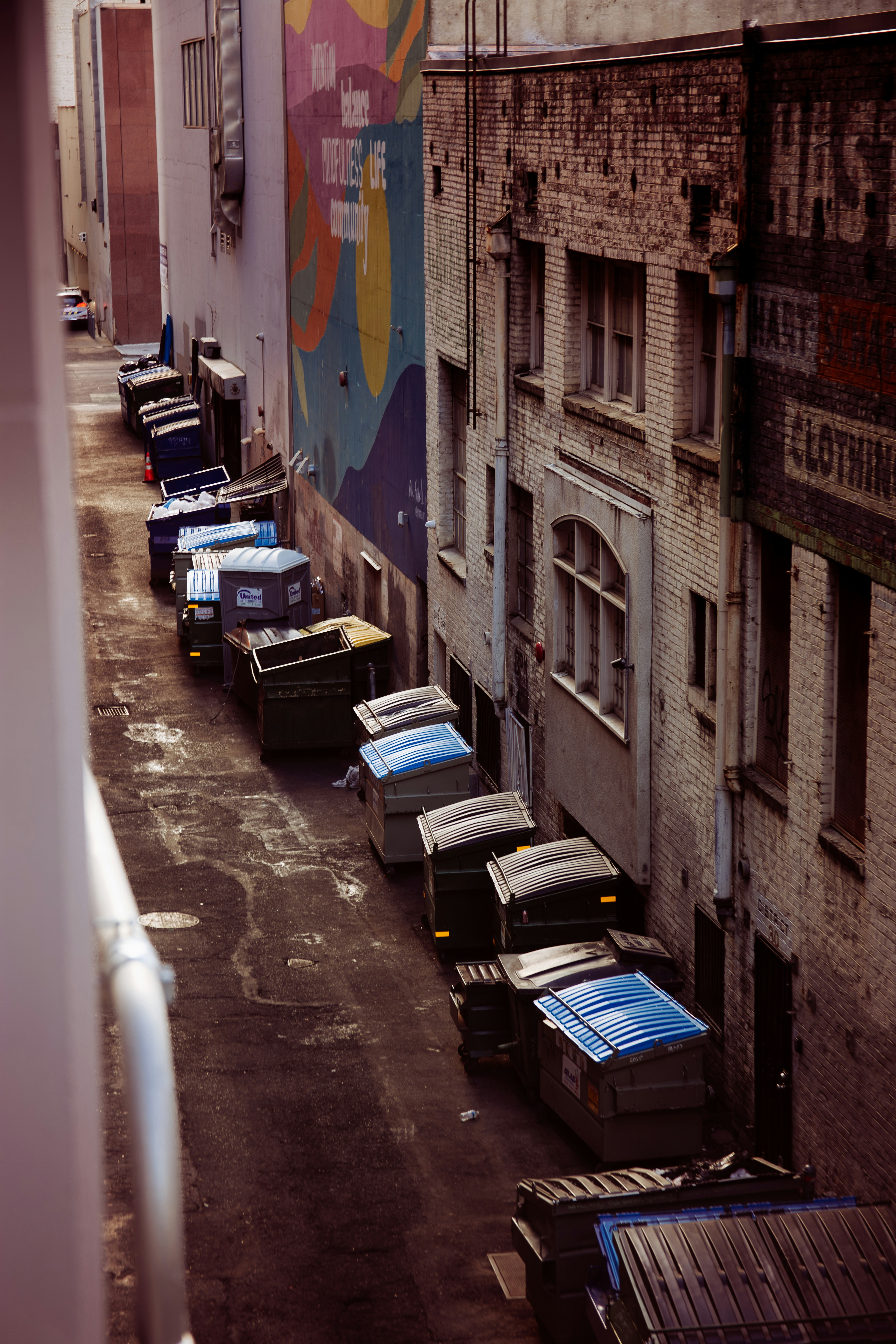 Back Alley Toward the Alley: Dumpster Line and Brick Wall Gallery