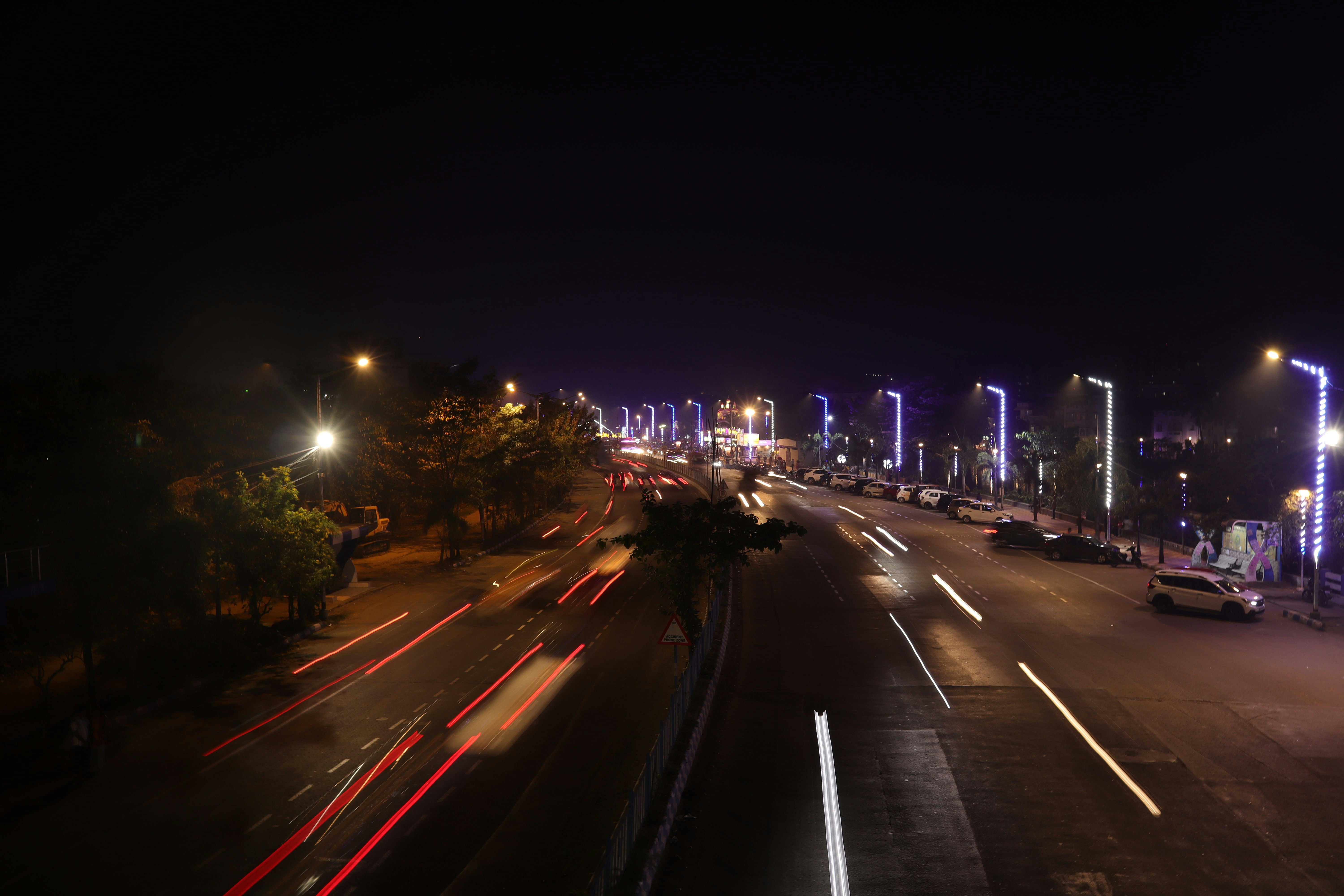 Night Run: Red Neon Trails Through a Quiet City Boulevard
