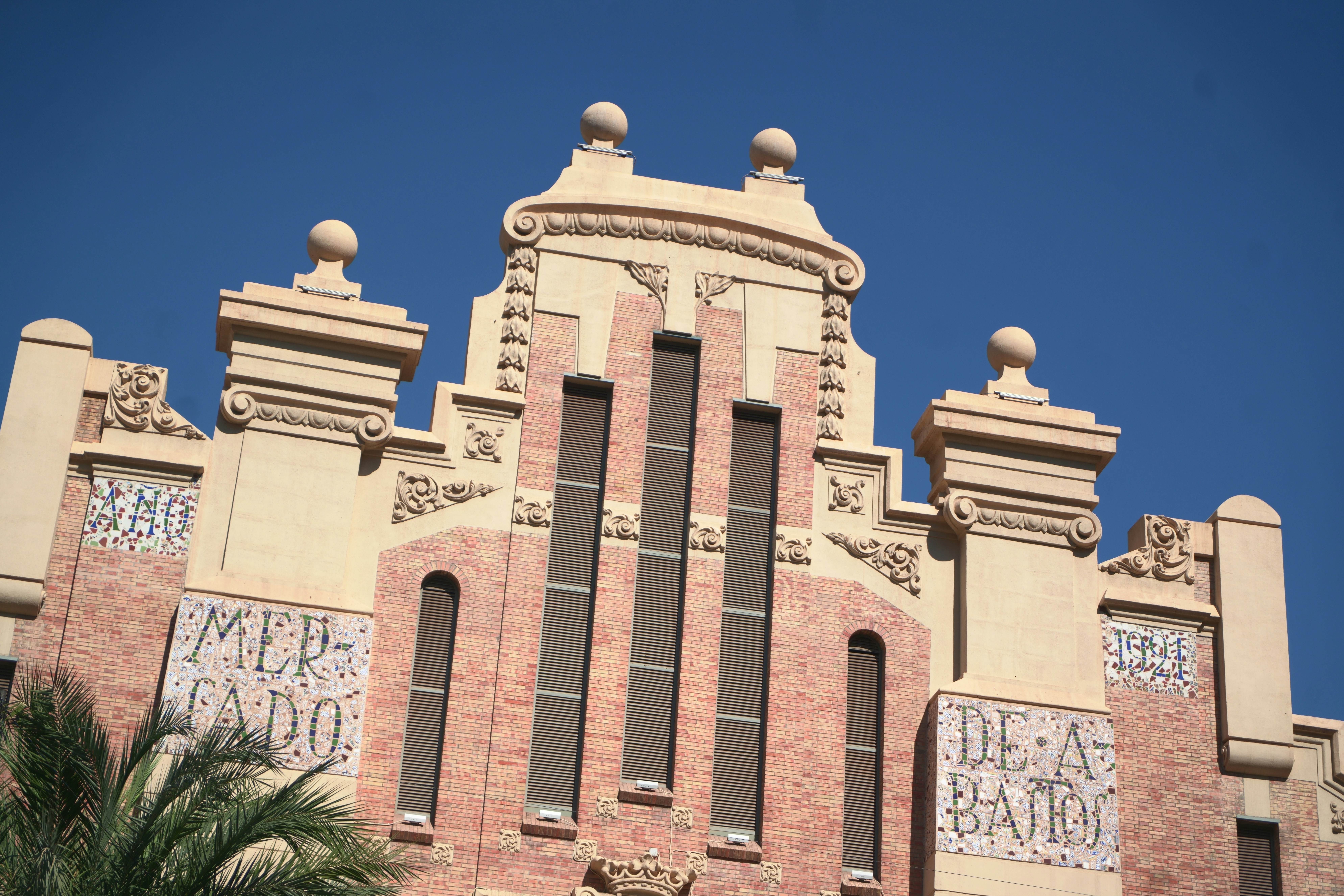 Mercado de A Bastos, Alicante. Brick facade, mosaic, old building, nude colours