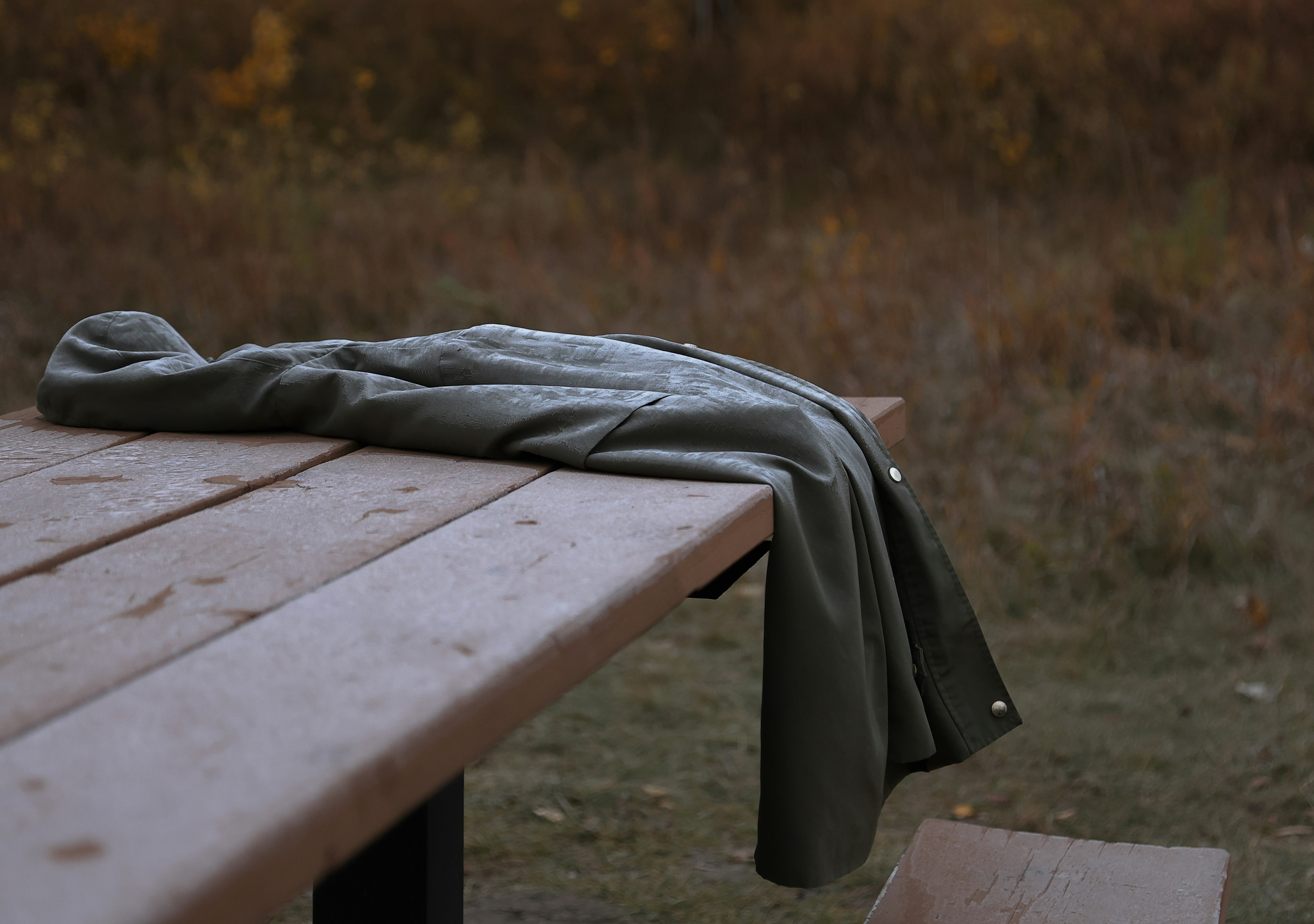 Coat Drape Over the Table Edge in Autumn Light