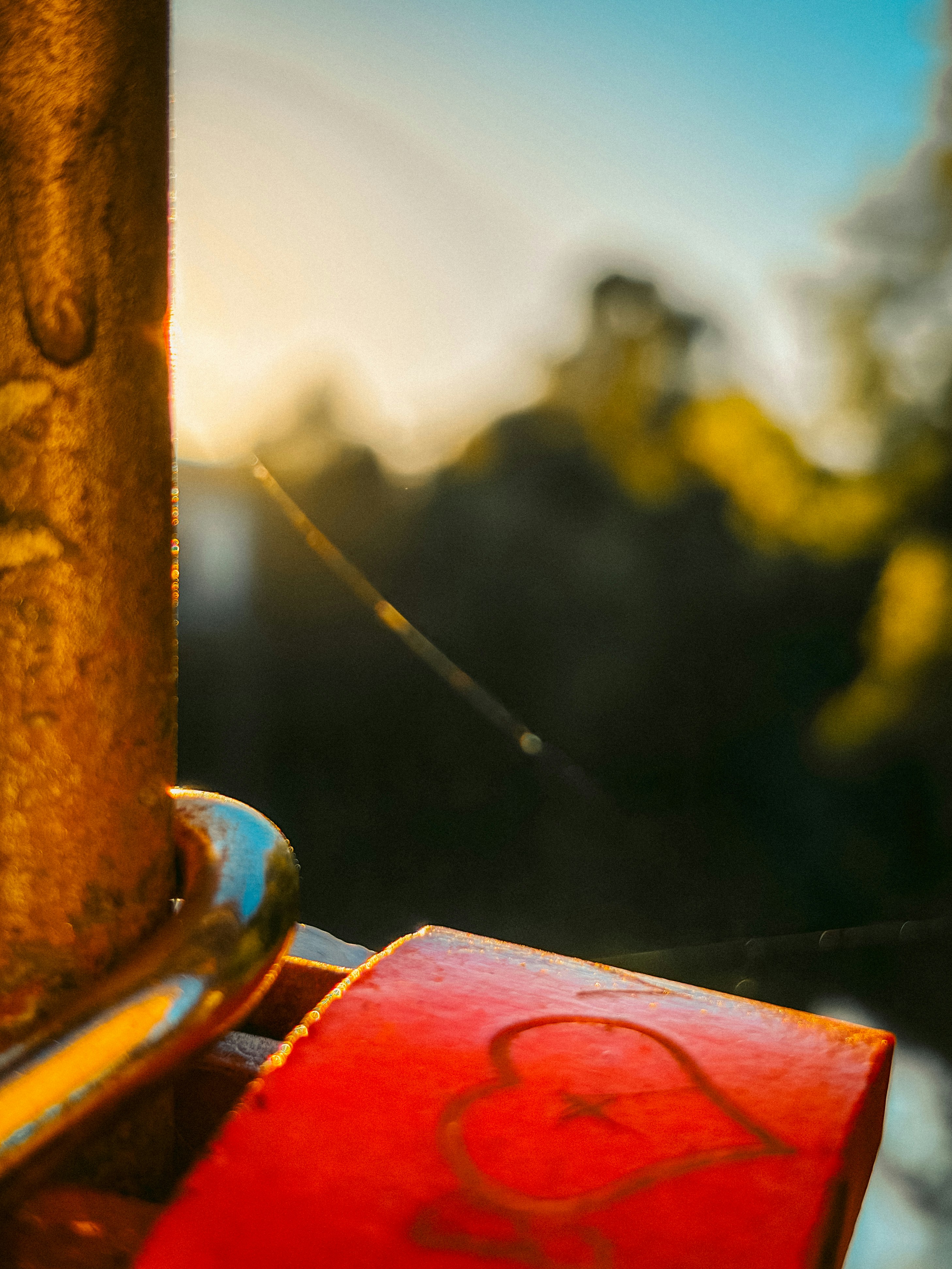 Locked in Love: A Rusted Bar, a Slim Strand of Spider Silk