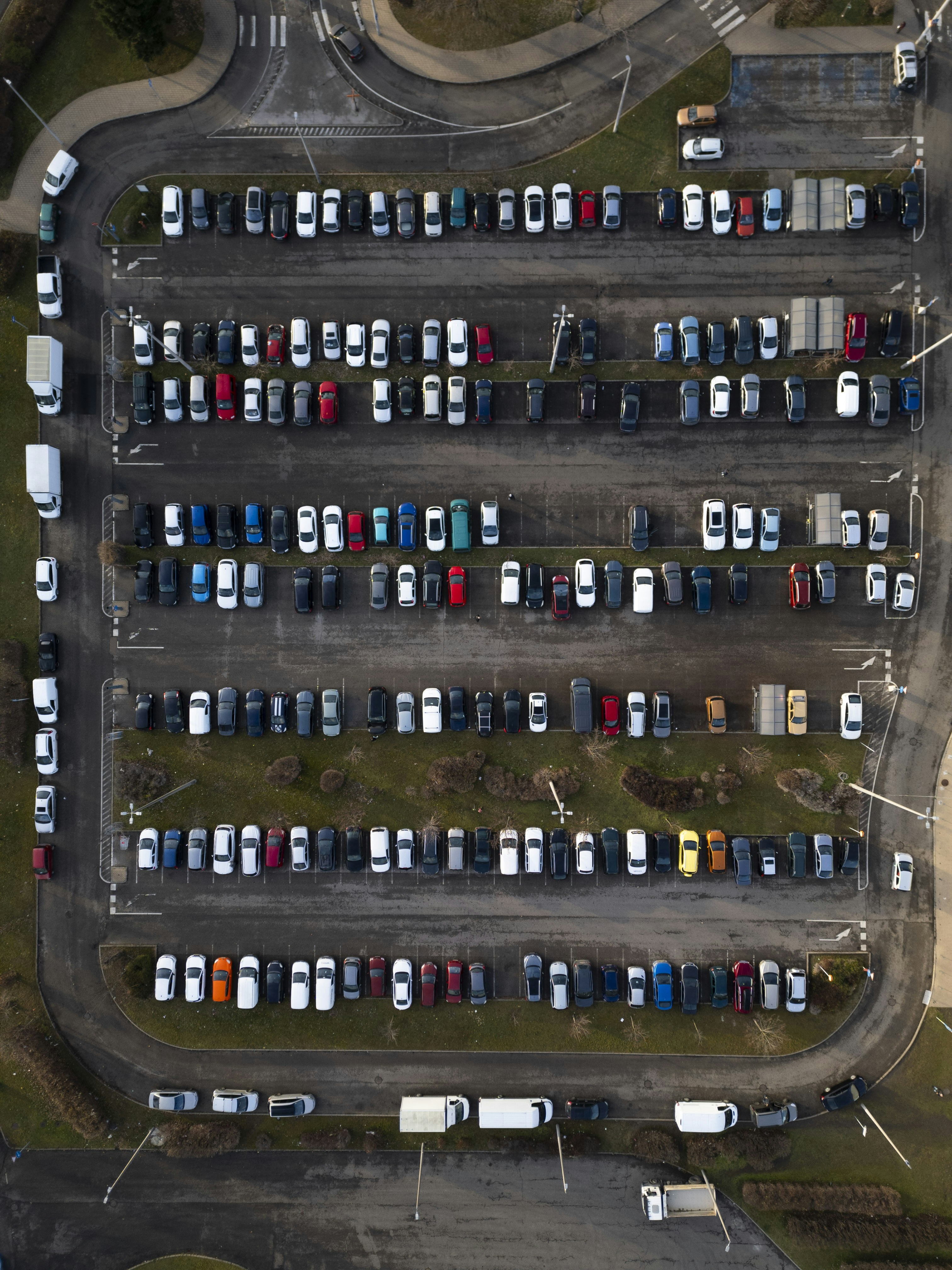 Symmetry in Metal: Aerial Blues and Rows of Cars