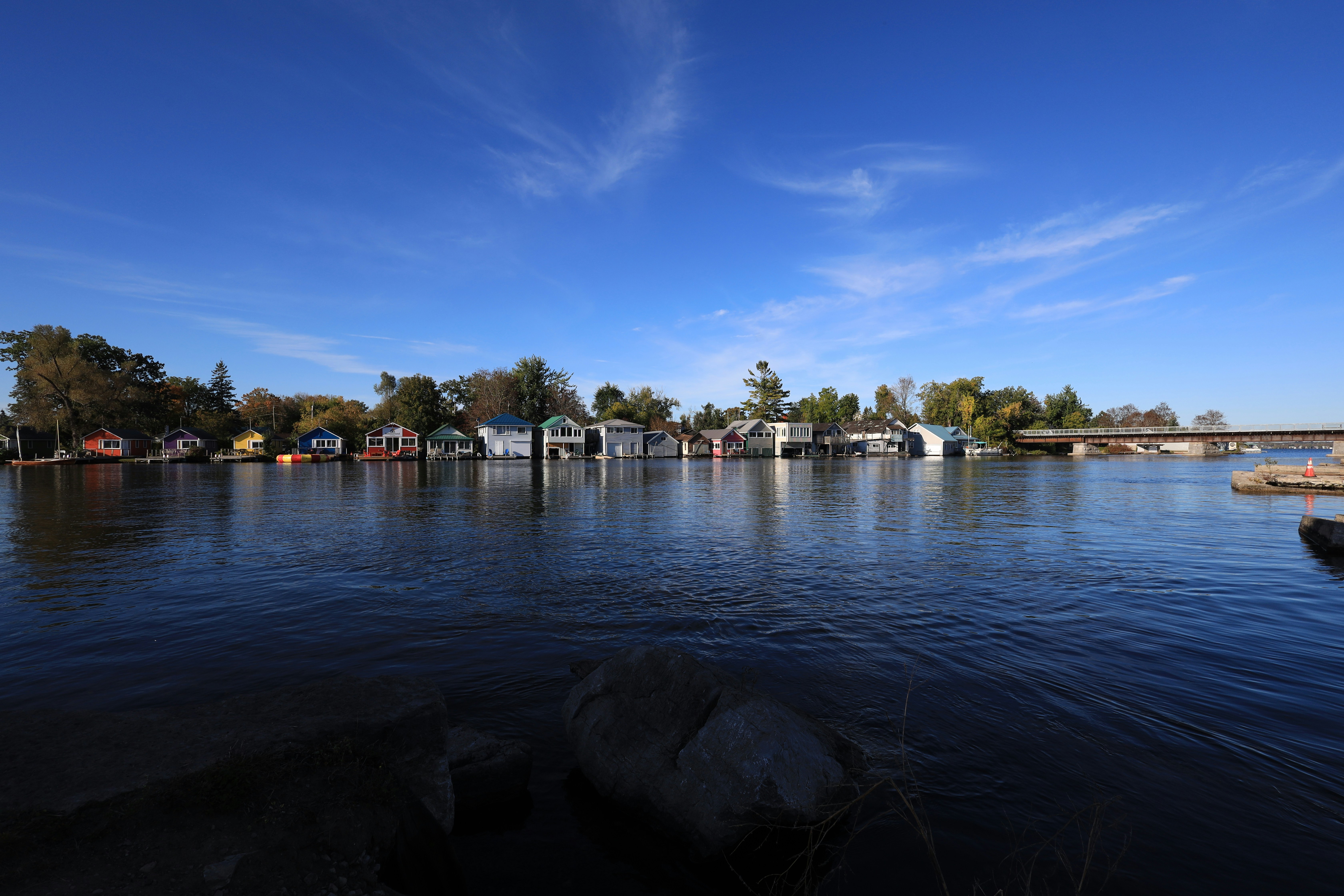 Harbor Houses at Dusk: A Waterfront Row of Colorful Boats