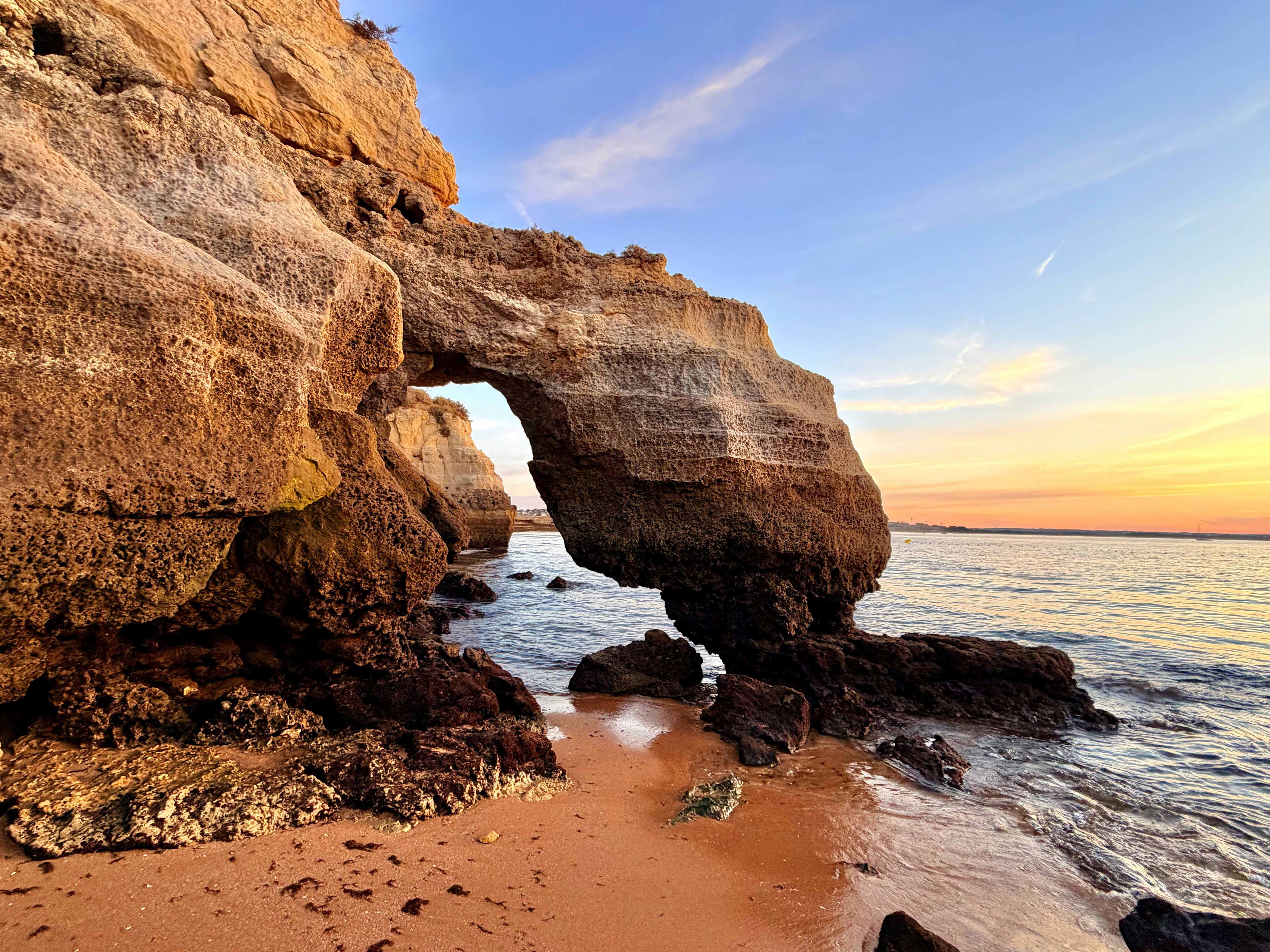 Sunset Arch: Golden Light Through a Coastal Rock Gateway