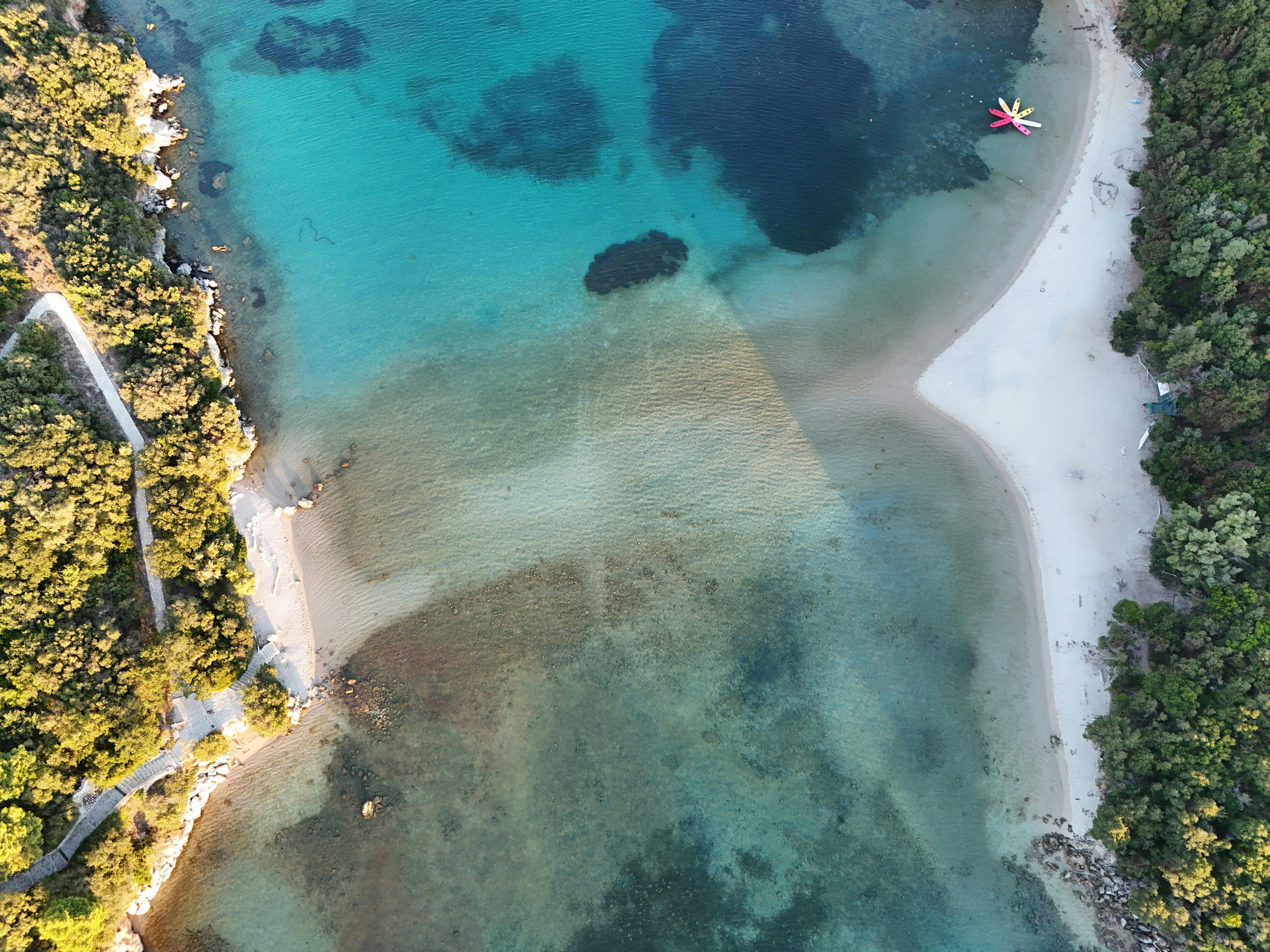 Turquoise Lagoon: Aerial Whisper Along a Curved Beach