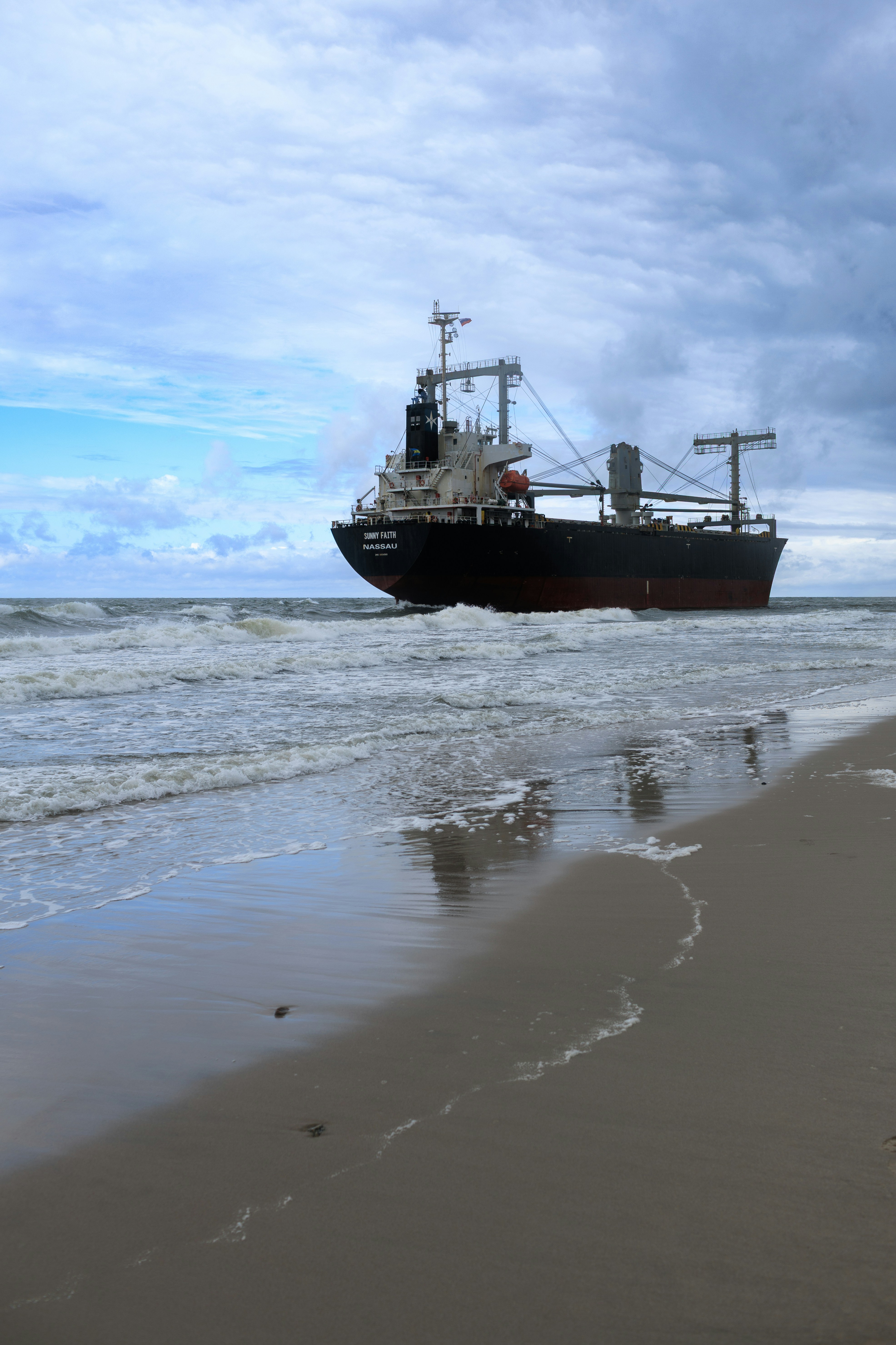 Translucent Horizon: A Cargo Ship Anchored Off a Quiet Shore