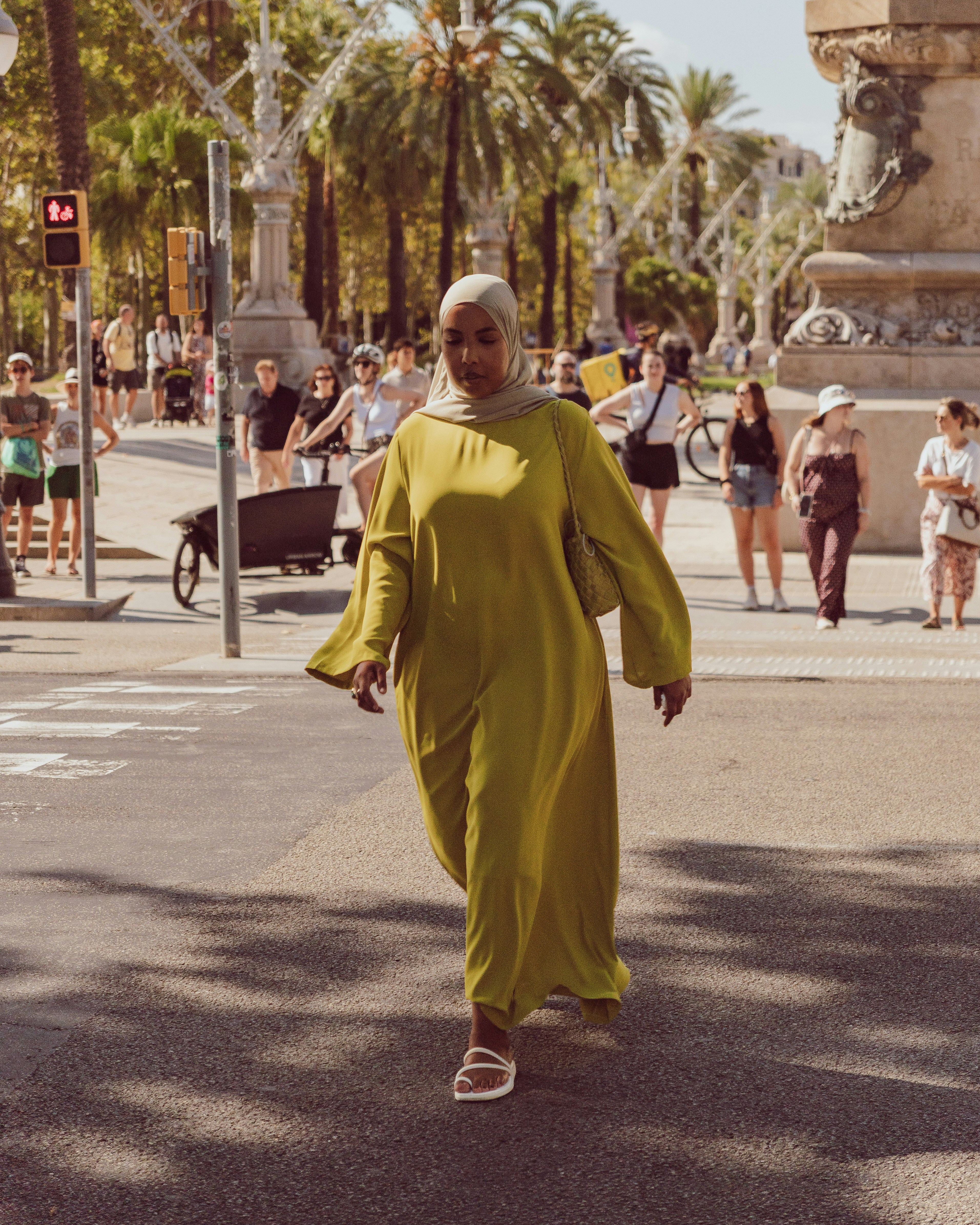 Yellow-Draped Walk: A Quiet Moment Among the City’s Pulse