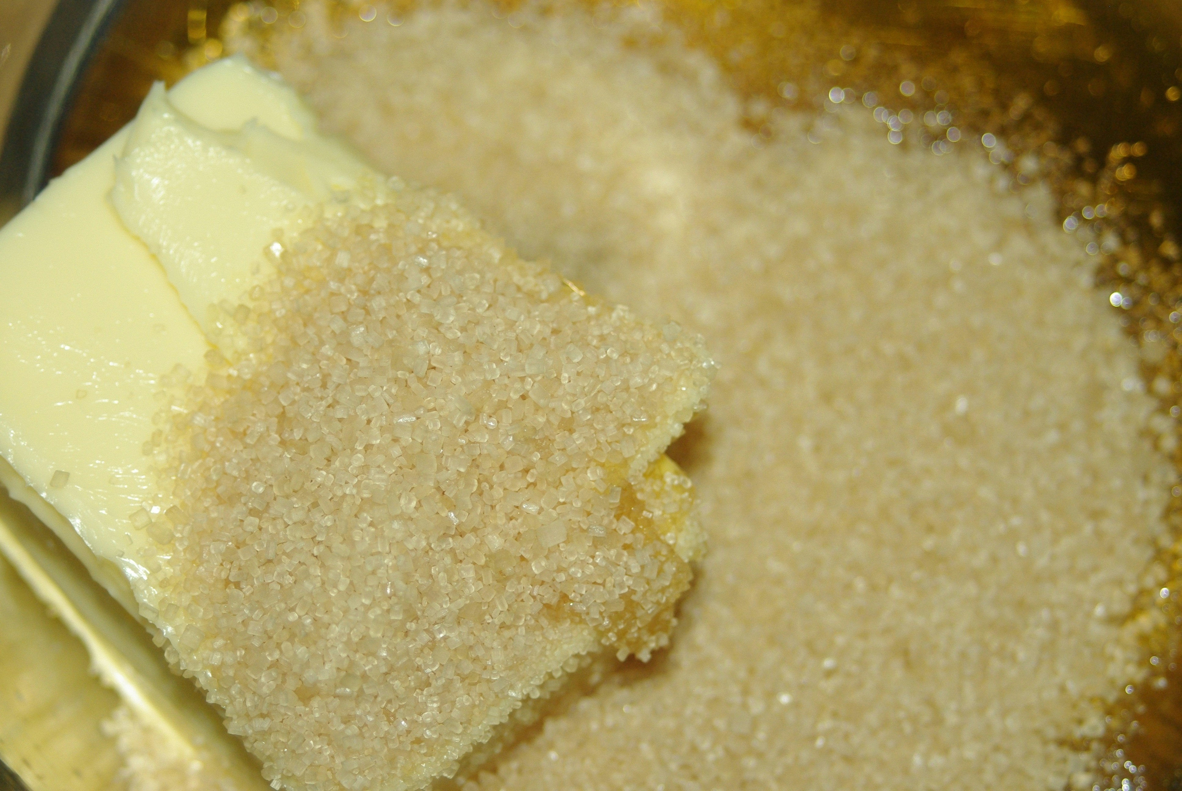 Sugary Peak: Butter Block Meets Granular Crystals in a Golden Mixture