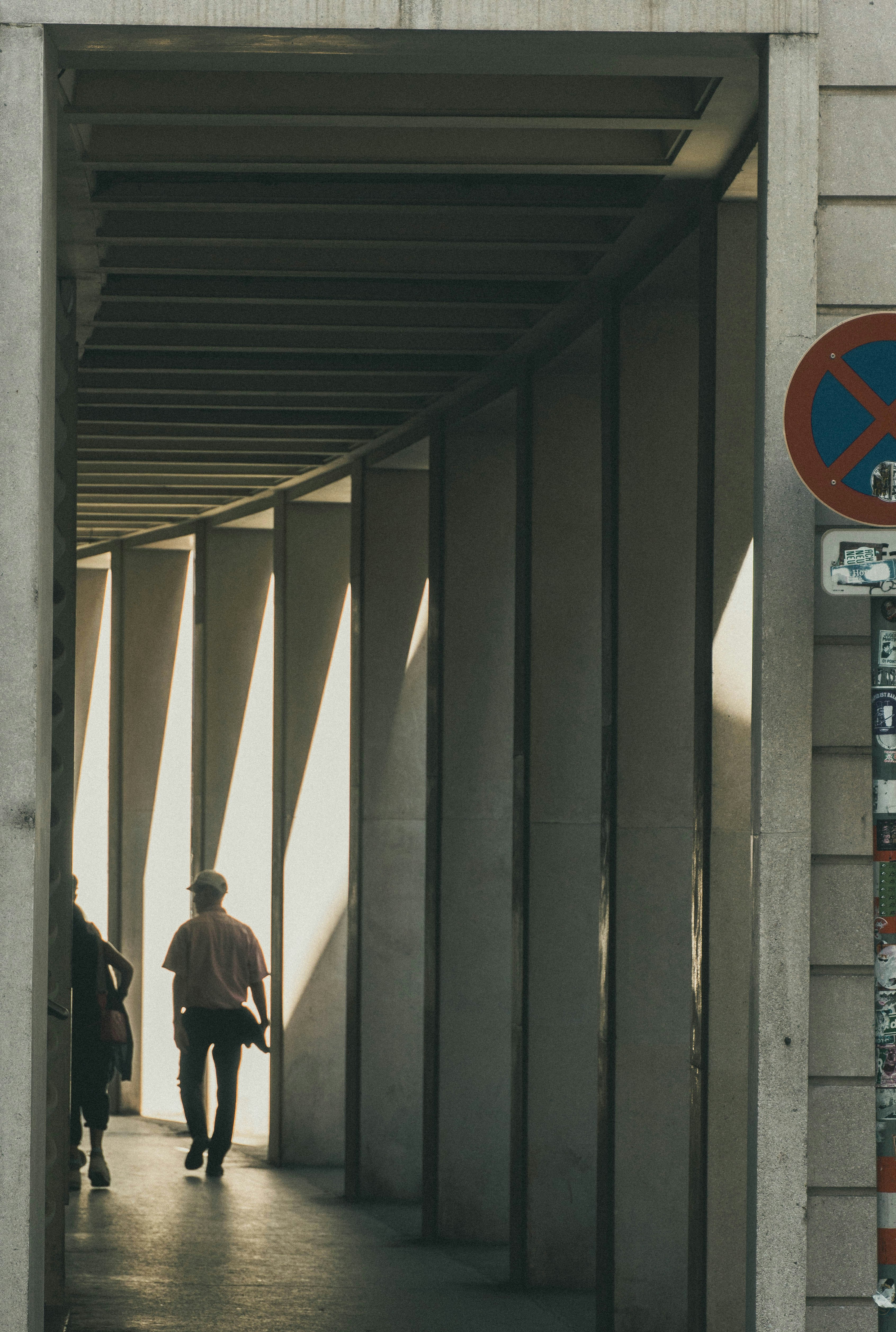 Shadowed Corridor: A Walk Through Concrete Rhythm