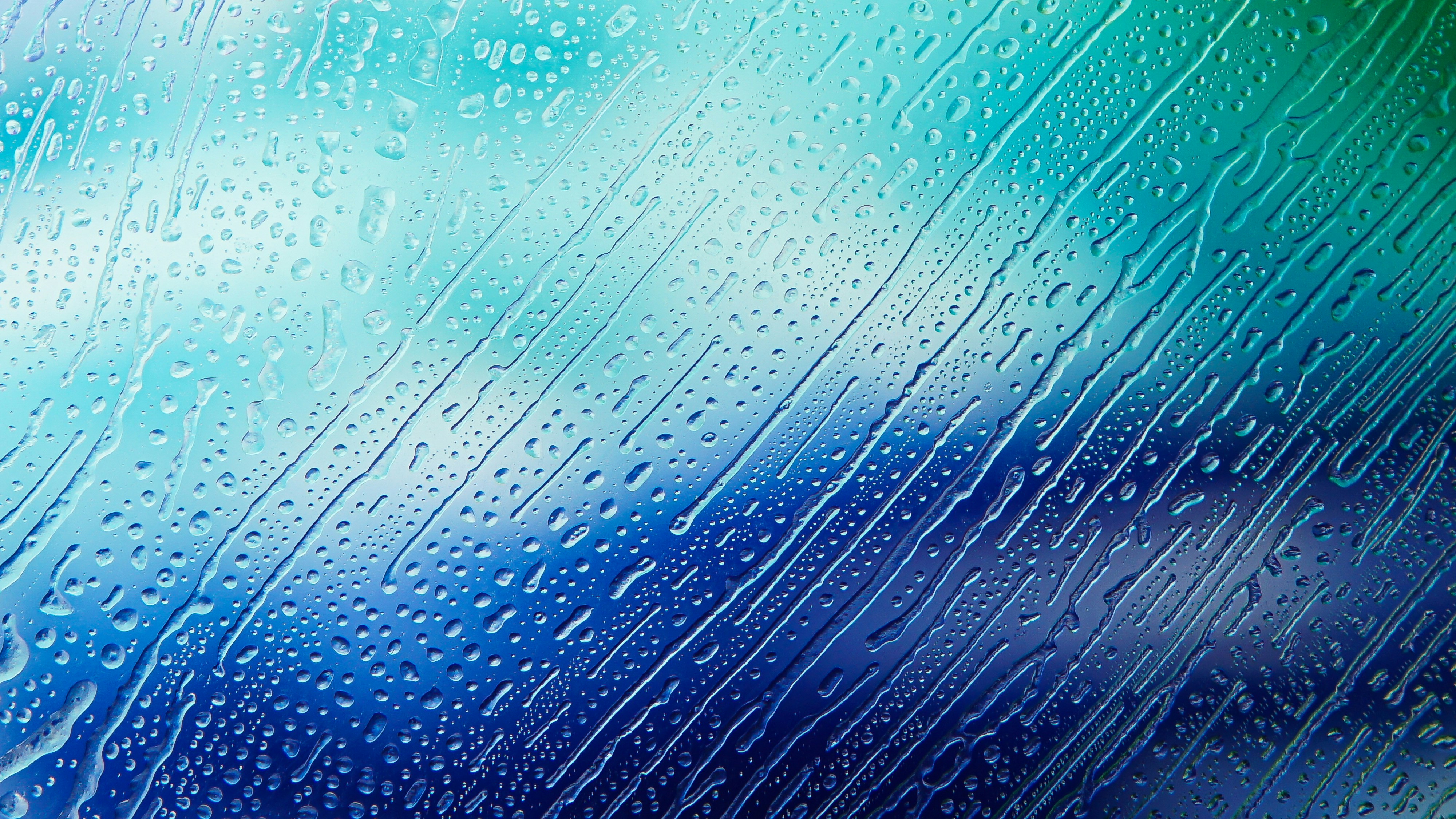 Diagonal Drizzle: Abstract Blue-Green Light on Glass