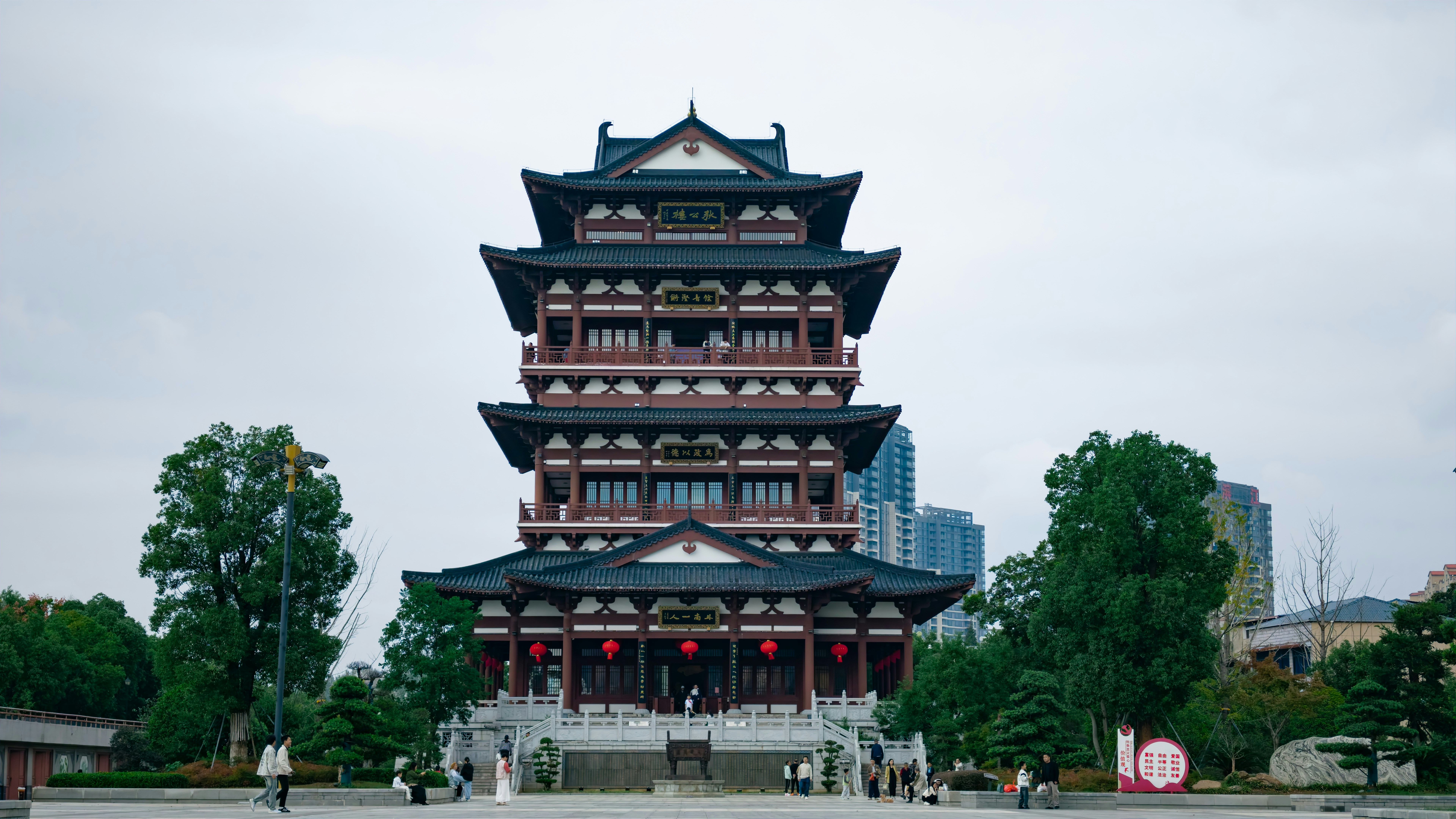 Five-Tiered Temple Rising Against an Urban Sky