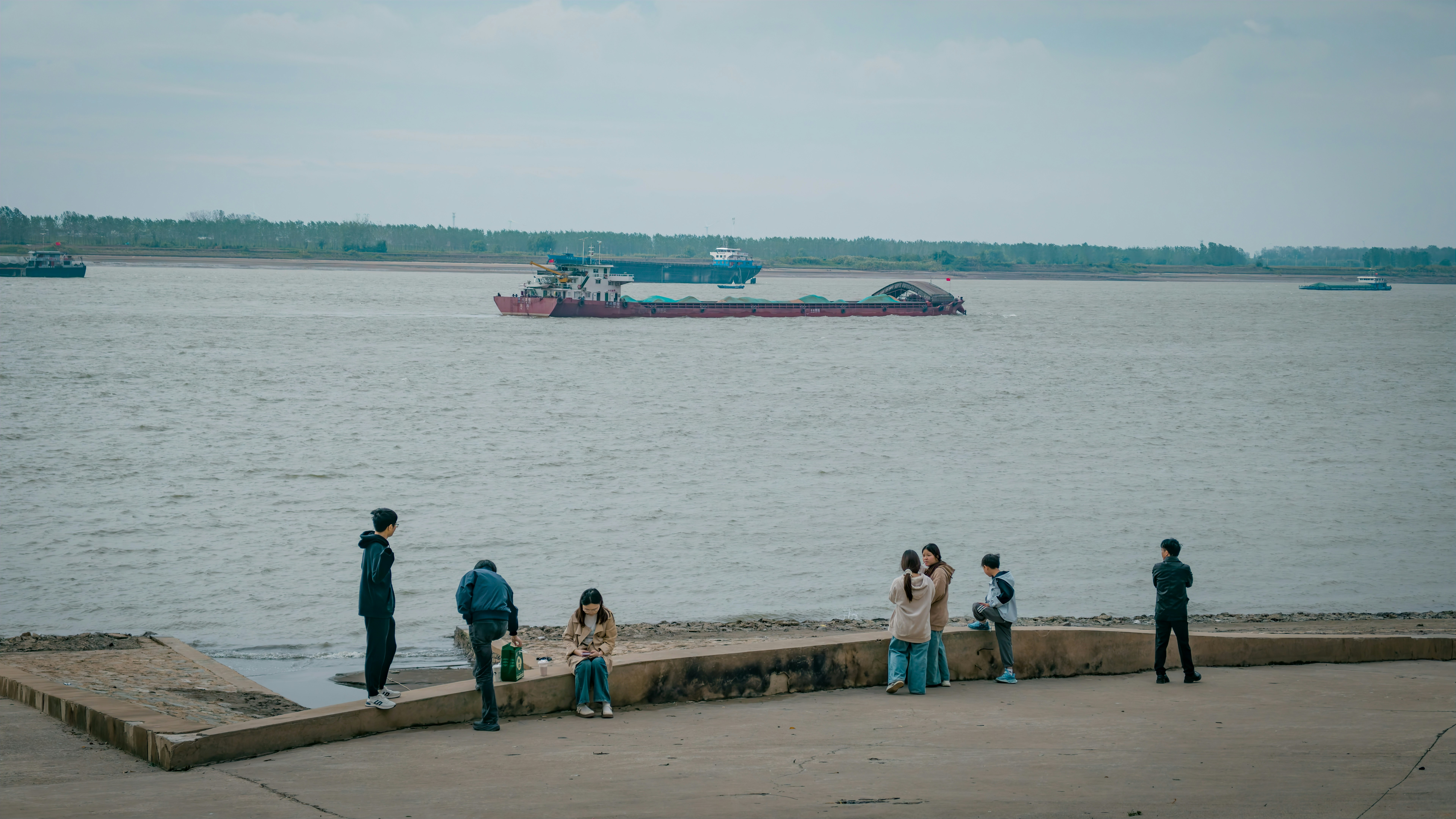 Rivertide Convergence: Faces and Boats by the Water's Edge