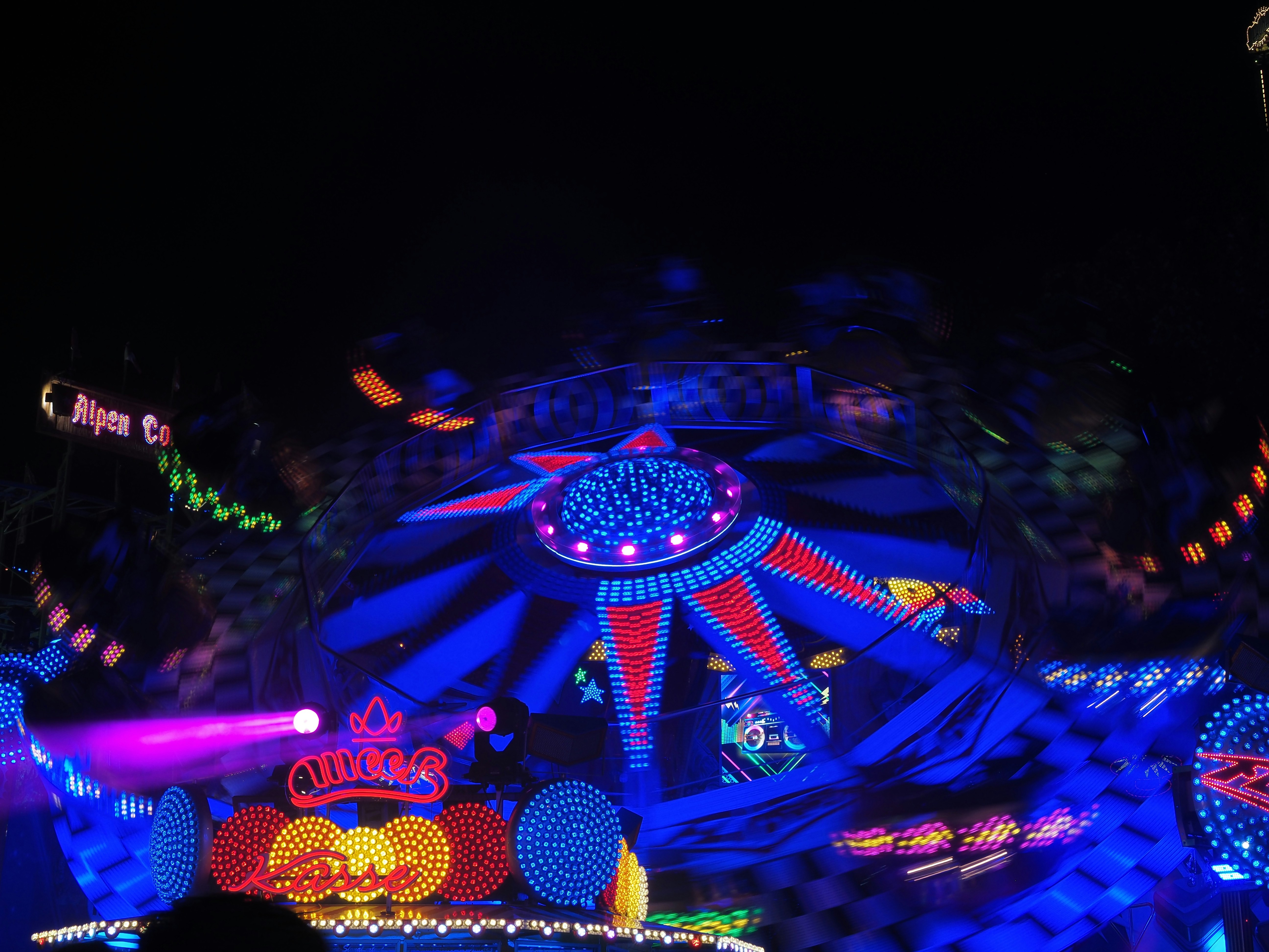 Neon Carousel at Night: A Dazzling Spin of Colorful Lights