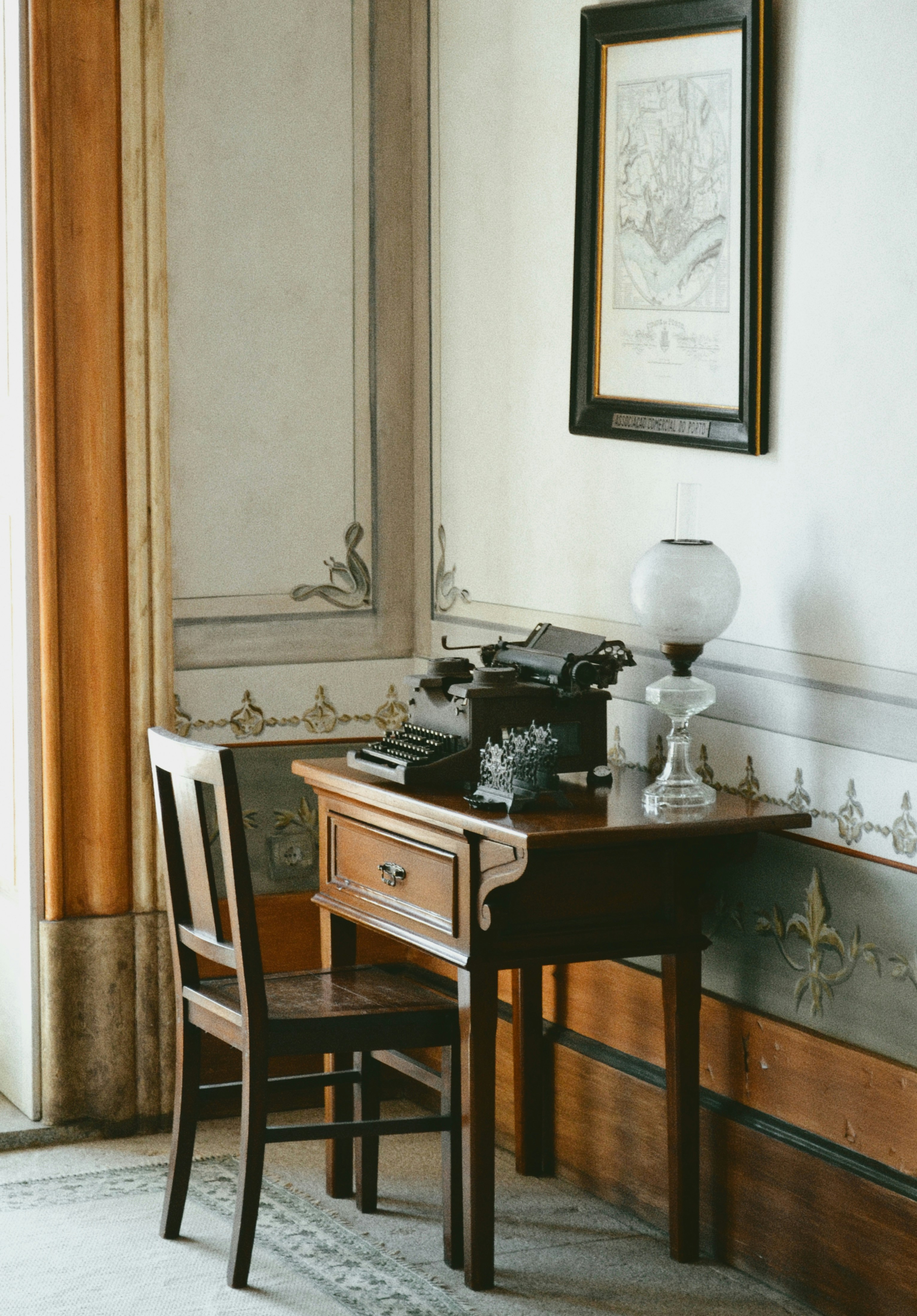 A Vintage Desk and Typewriter in a Sunlit Corner