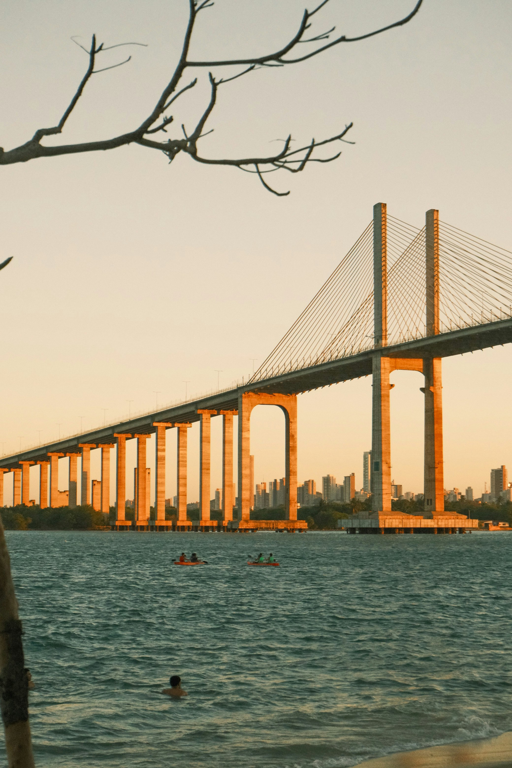 Golden Hour Span: A City Bridge Over Calm waters