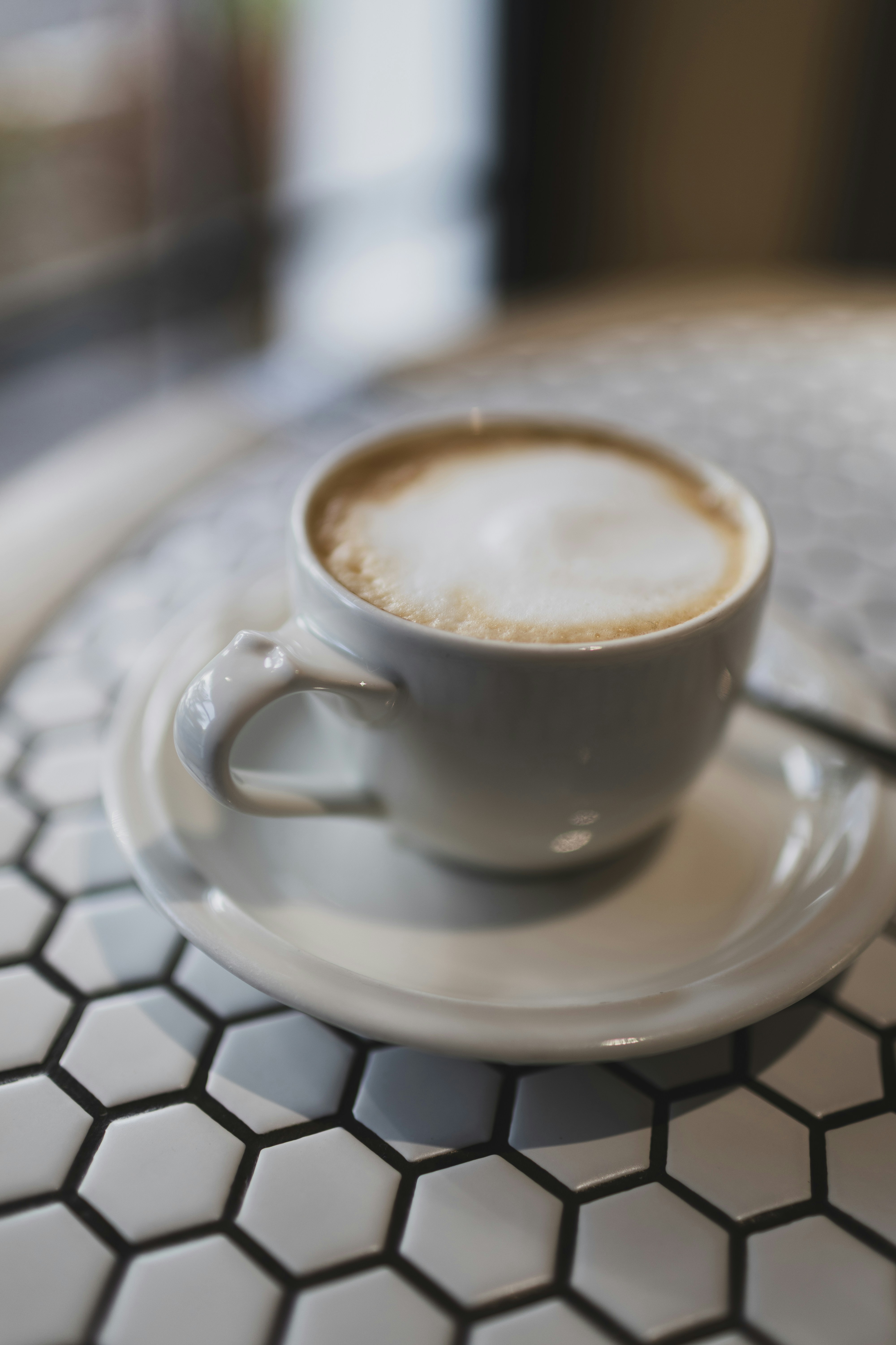 Steam and Silhouette: A Quiet Cup on a Hexagonal Table