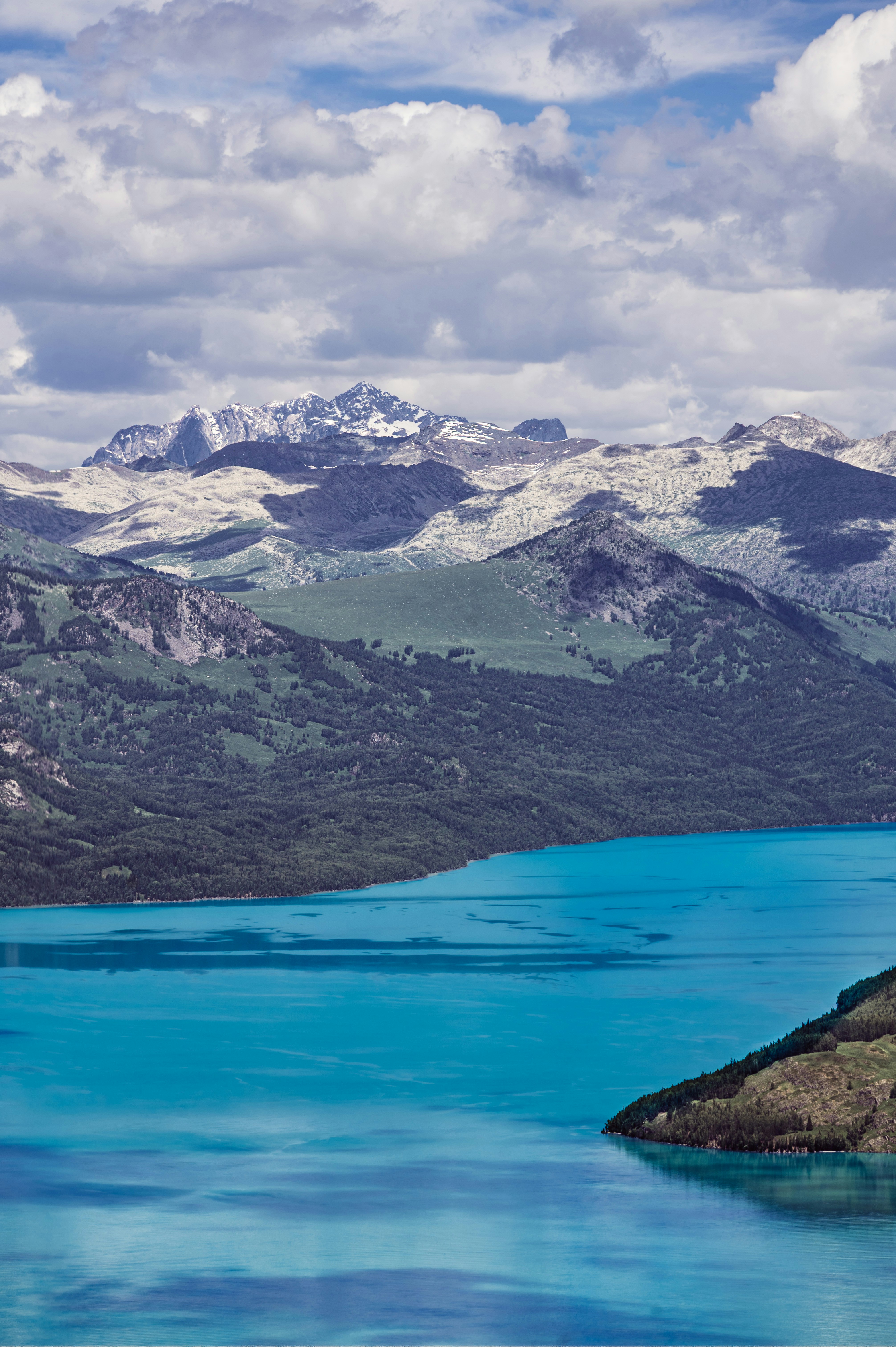 Turquoise Fjord Under Snow-Capped Peaks