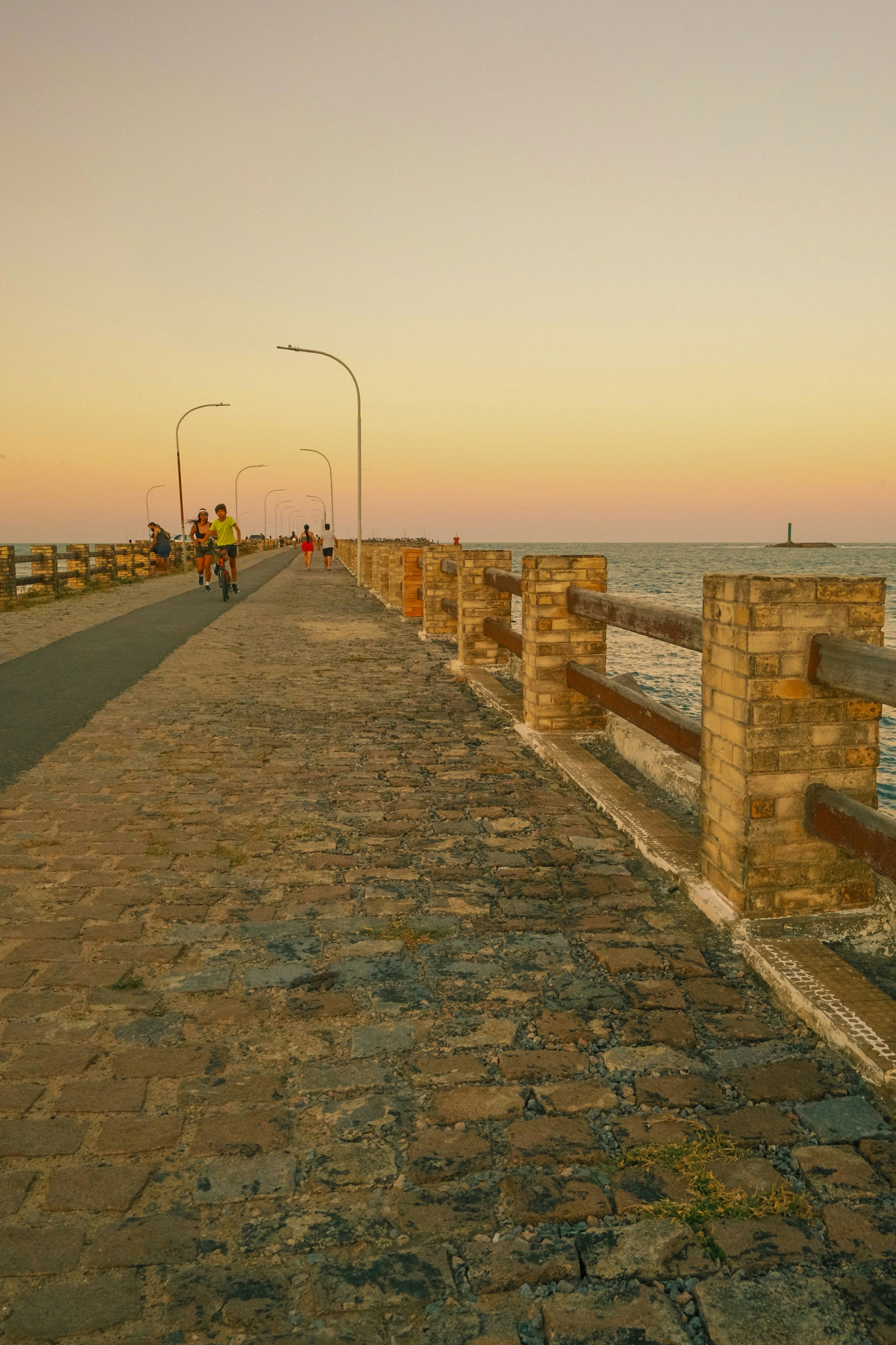 Golden Hour Promenade: Cobblestones Leading to the Horizon