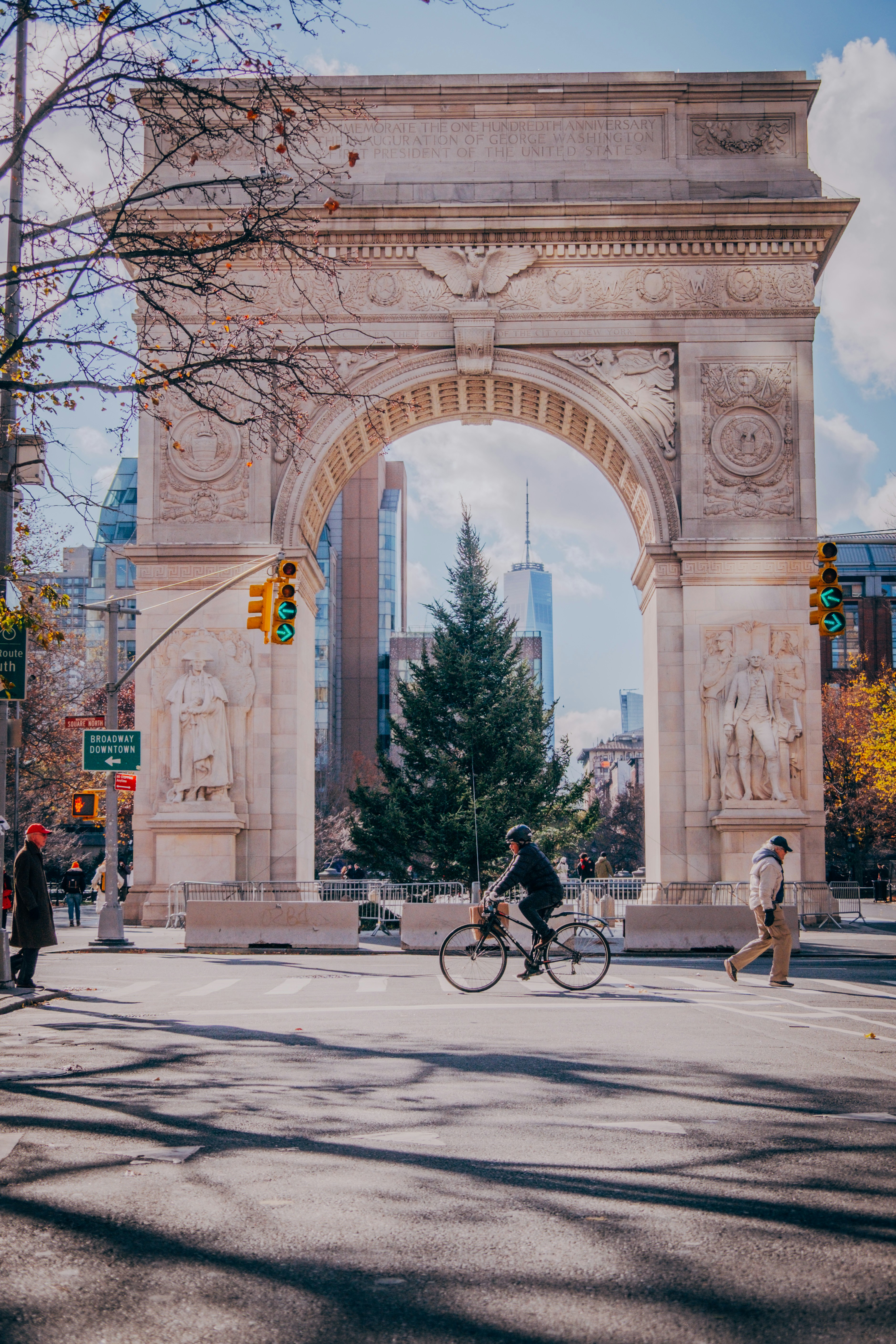 Arc Under the City: Bicyclist, Pedestrians, and a Marble Gateway