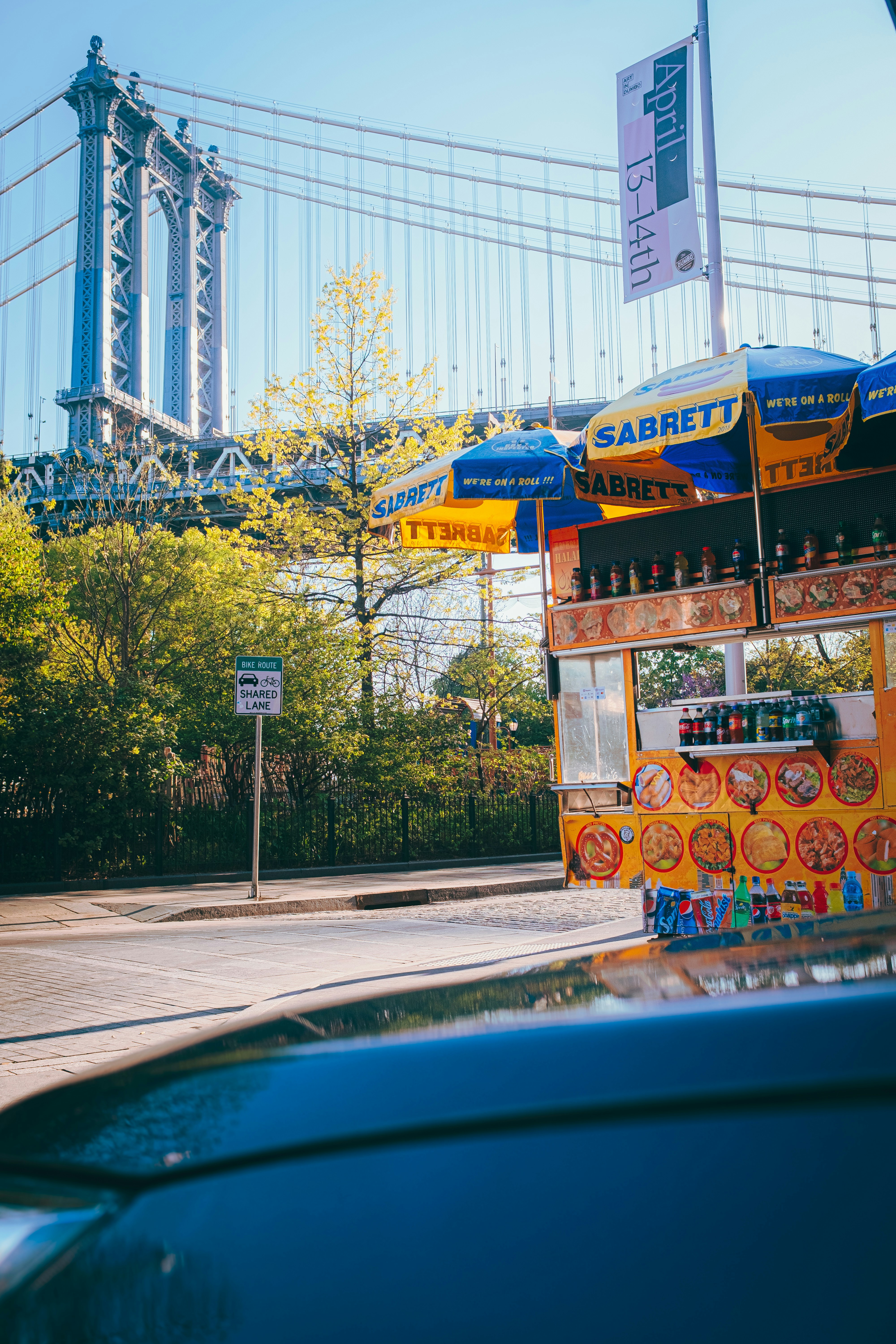 Empire of Color: A Street Corner Popcorn Stand by the Bridge