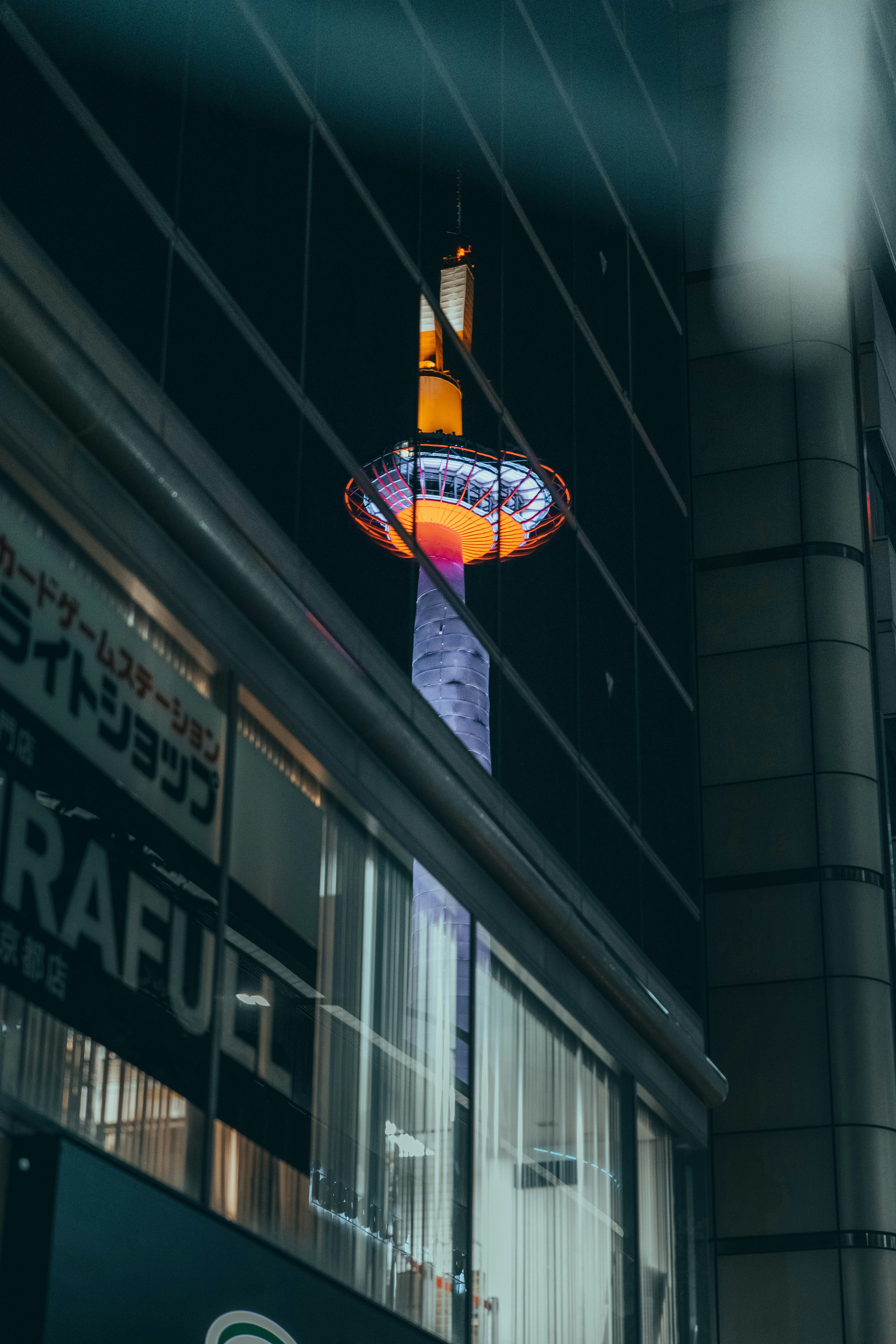 Neon Needle: Tower Glow Between Glass and Neon