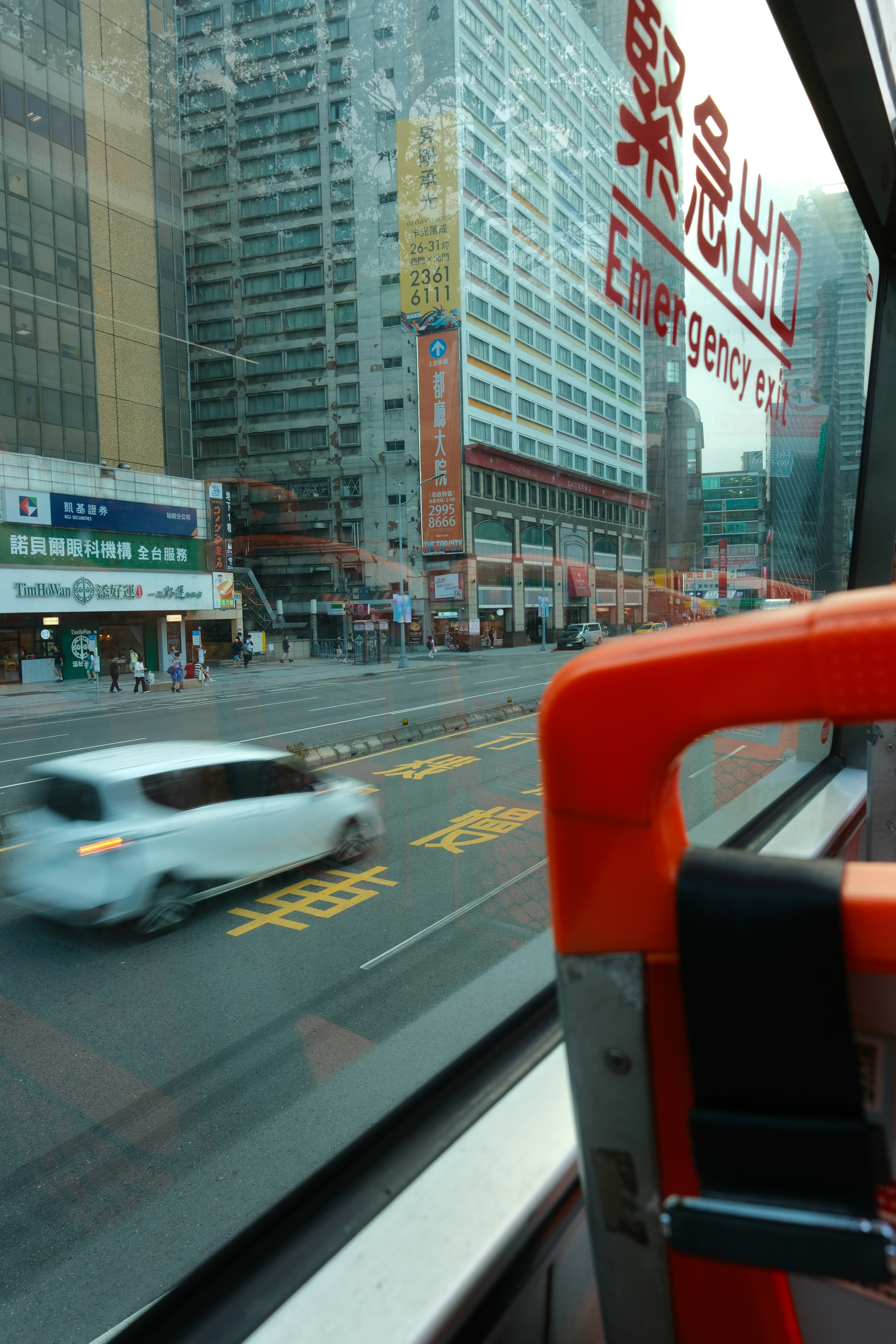 City Bus Window View: Street Life Through Glass