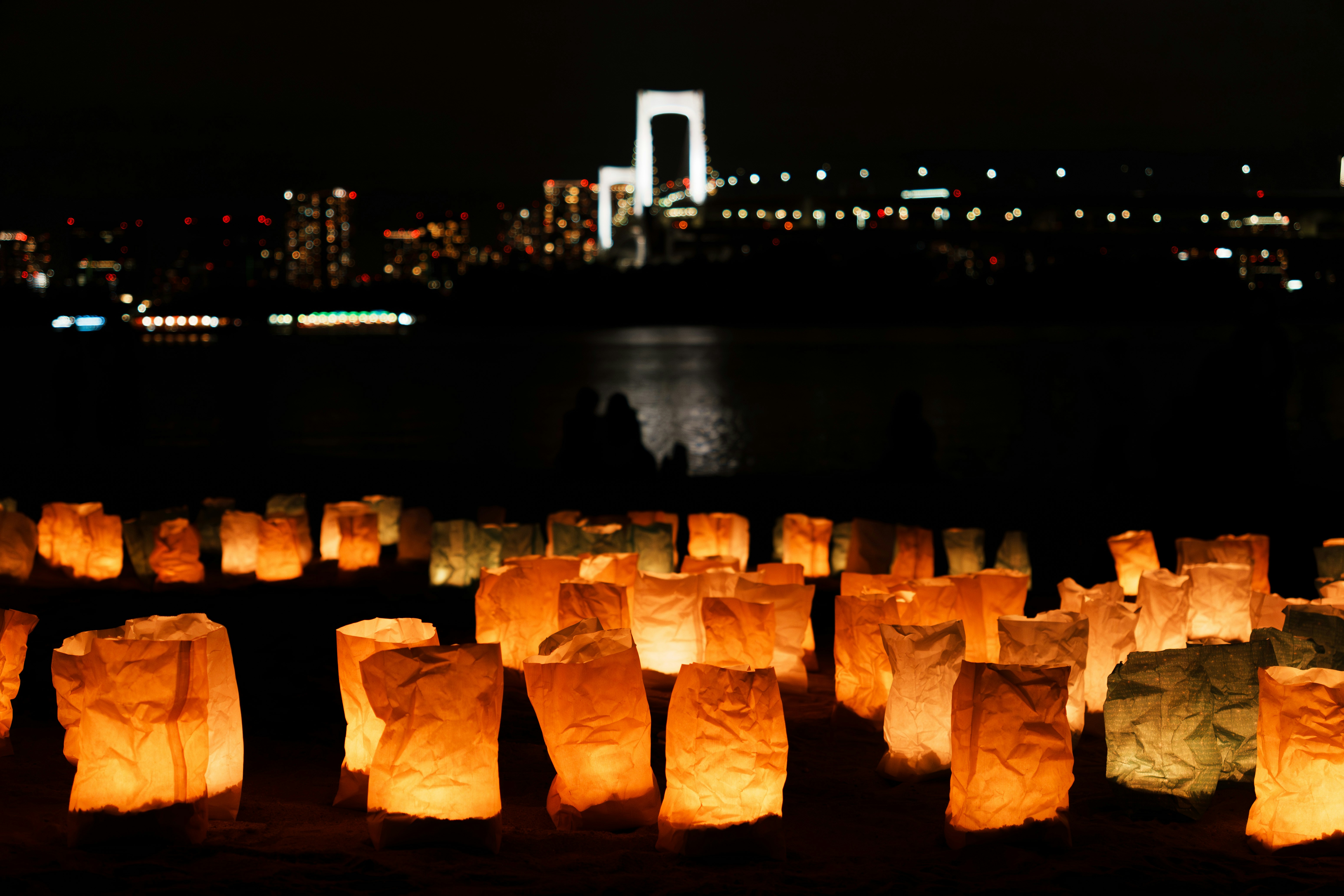 Lantern Sea of Fire: glowing paper lumières on a dark riverside