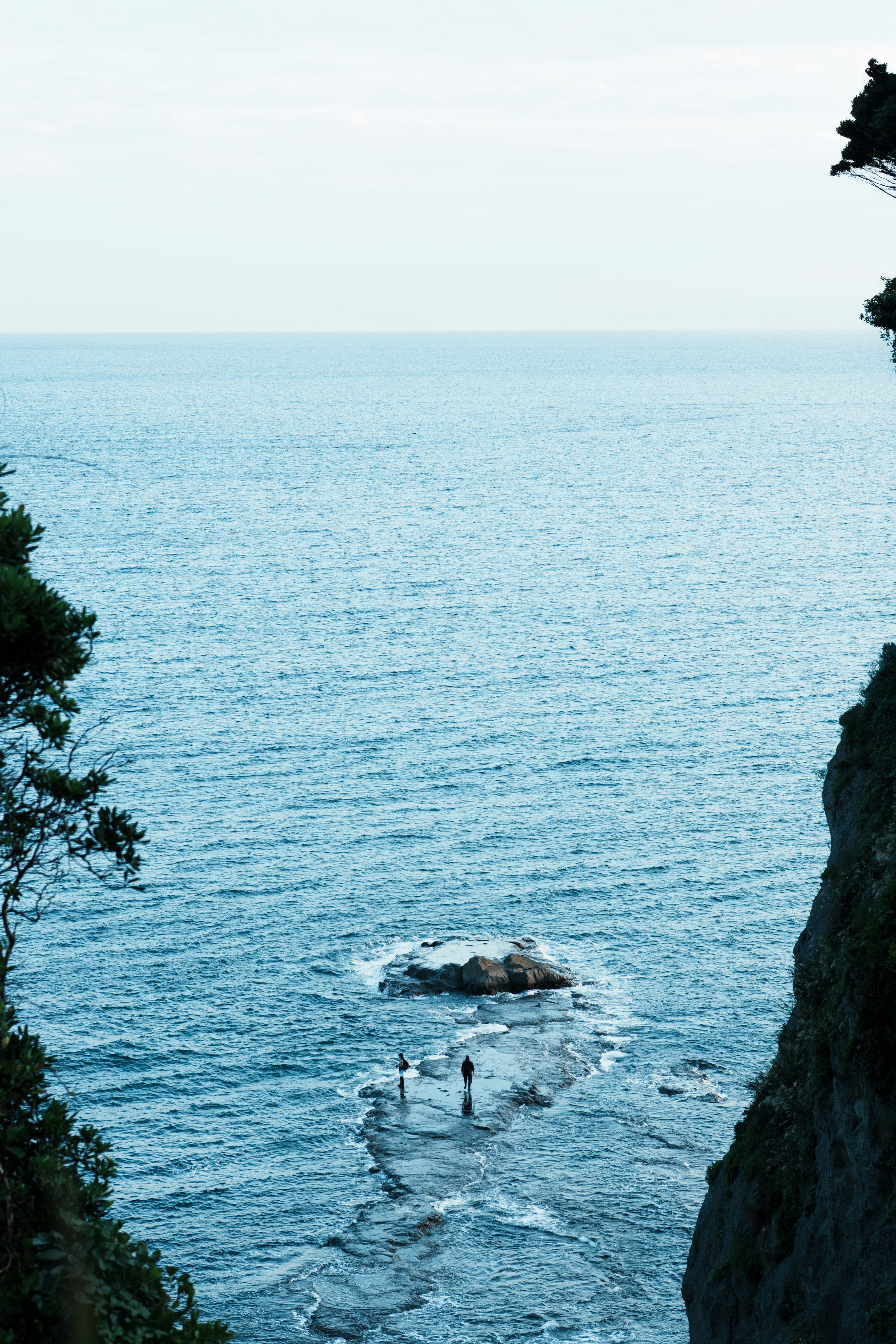 Sea Gap: Narrow Boat Path Between Cliff Faces