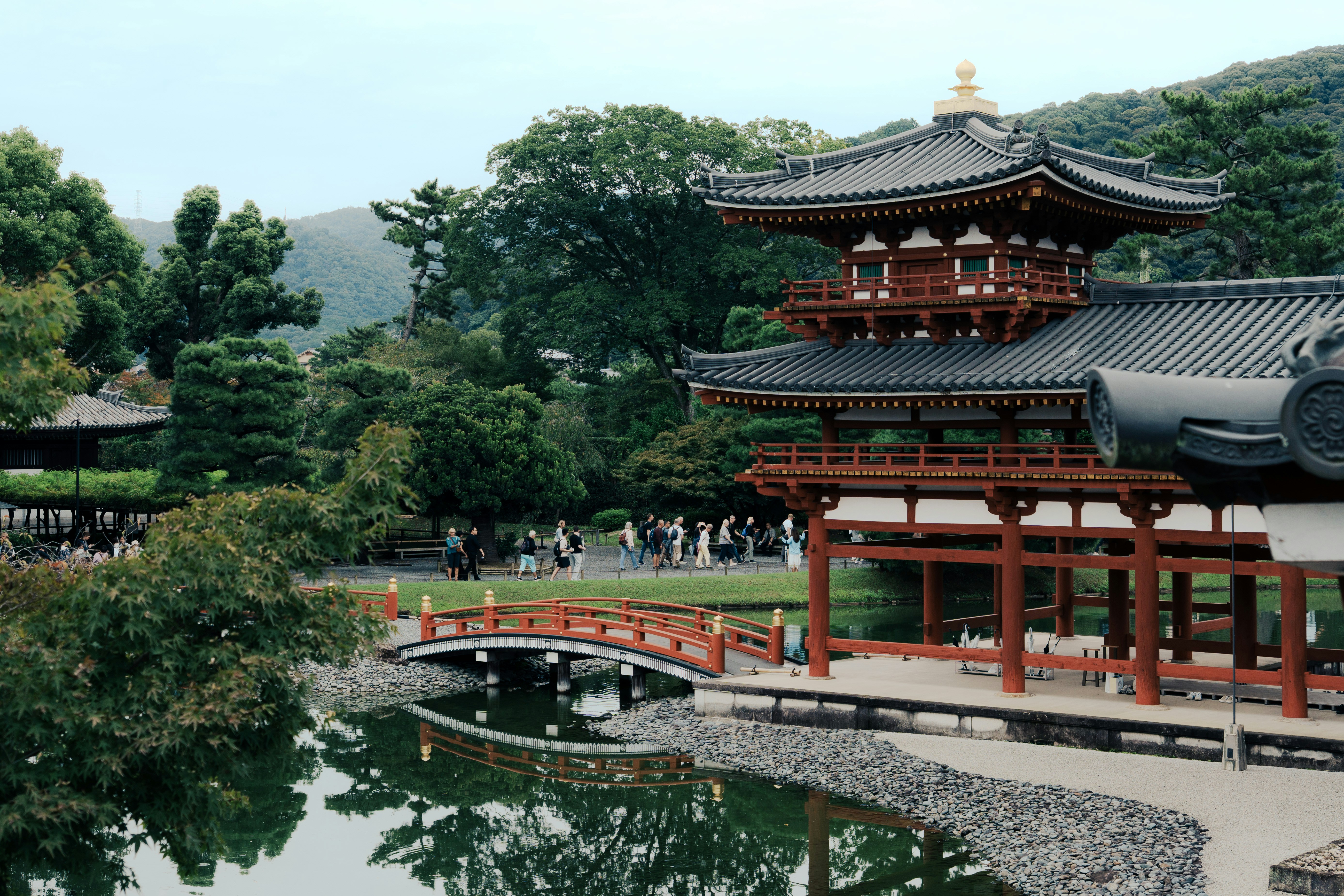 Red Gate Over Water: A Tranquil Temple Scene