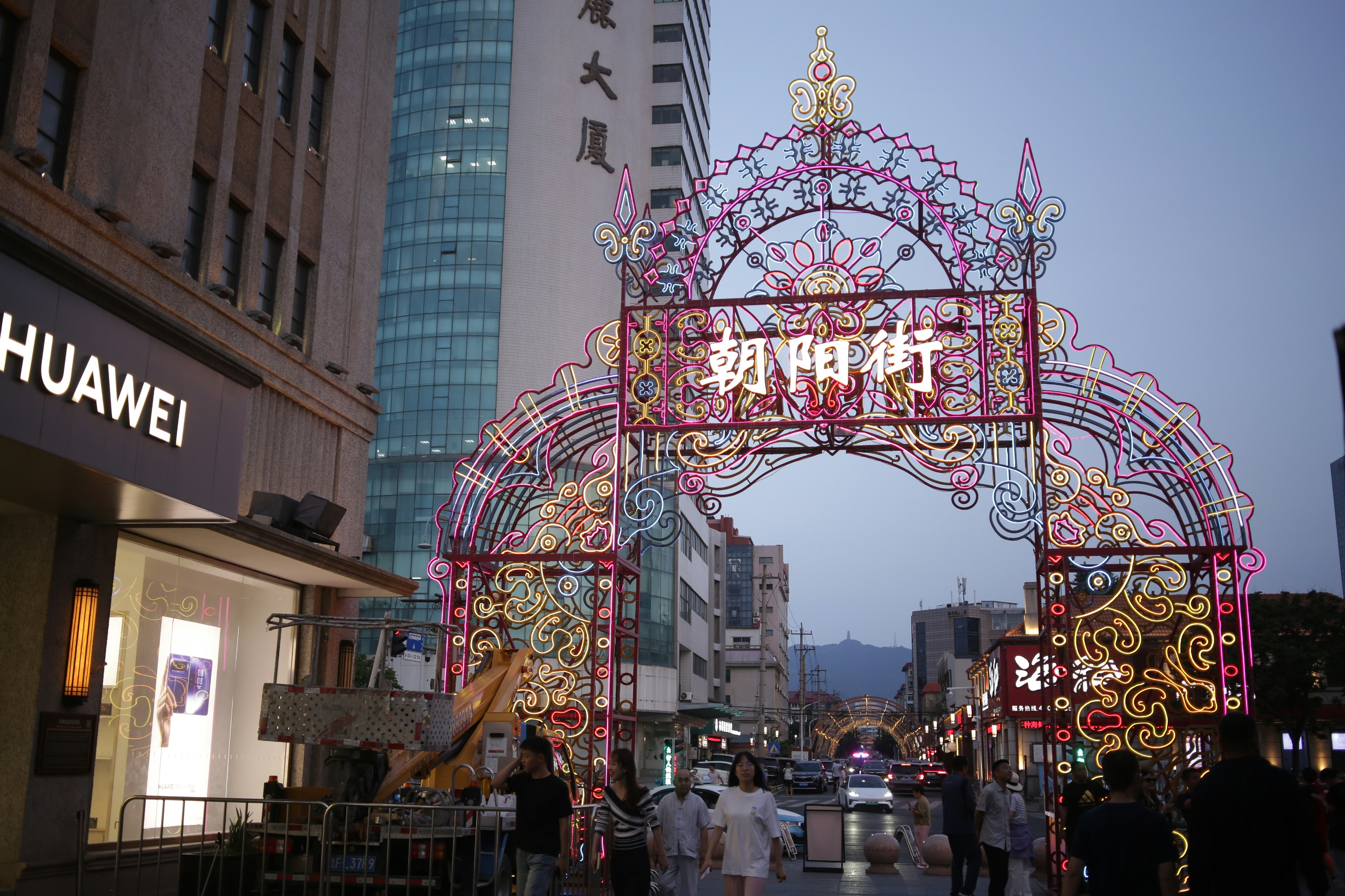 Neon Archway at twilight: Chinese lantern spectacle above a bustling street