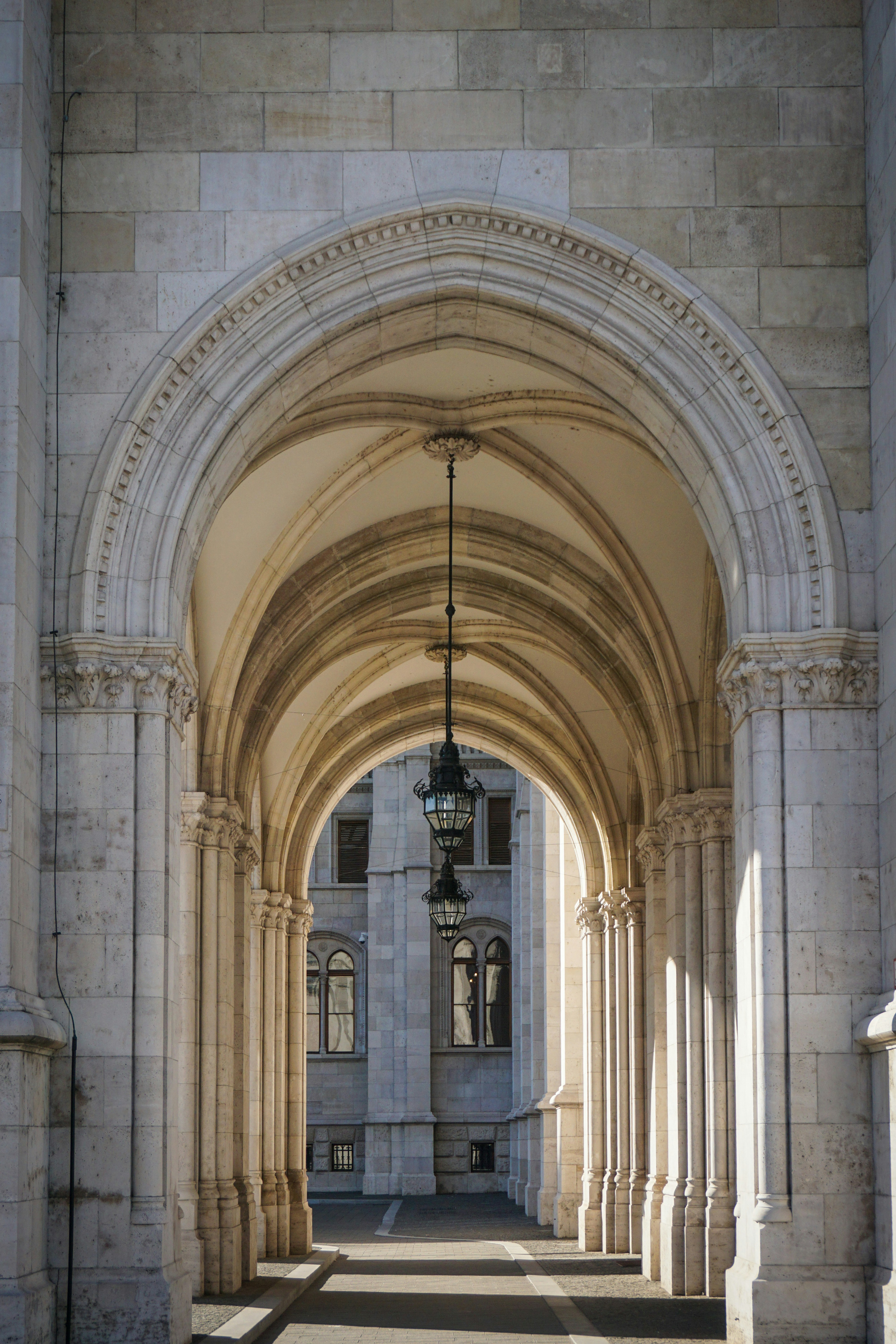 Arcade of Light: Carved Shadows in a Marble Corridor