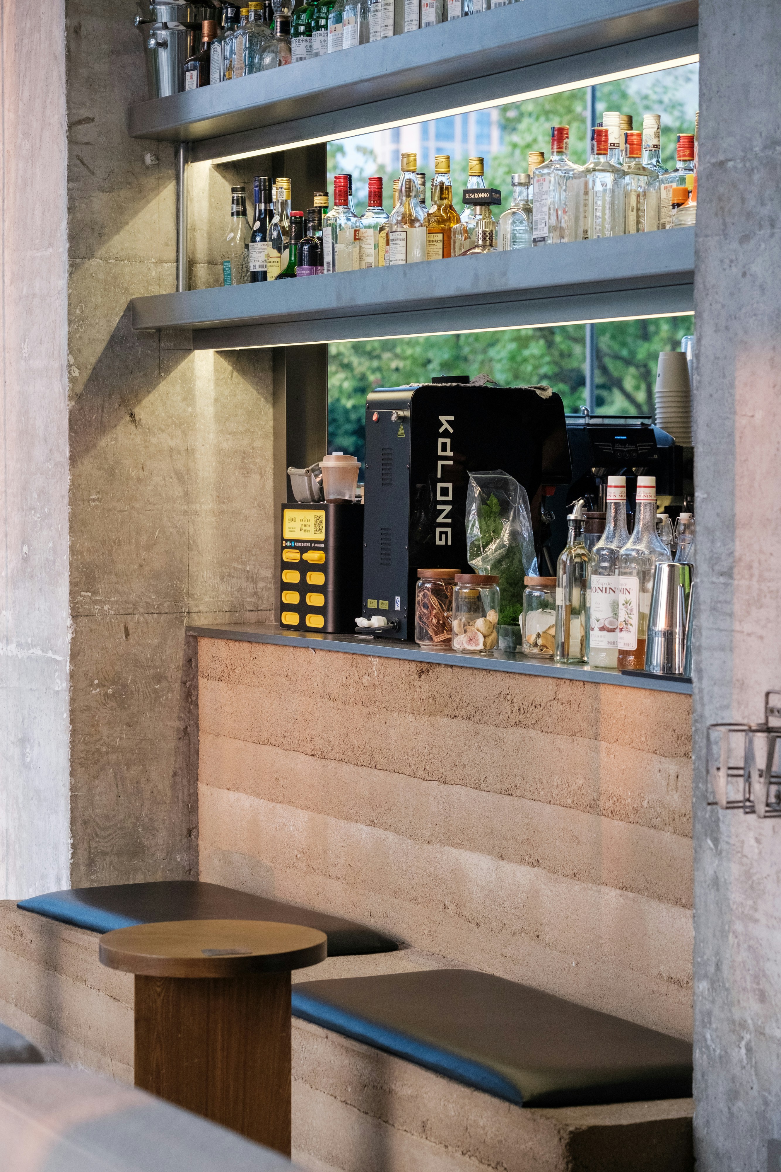 Concrete Barscape: Bottles, Coffee, and Bold Lines