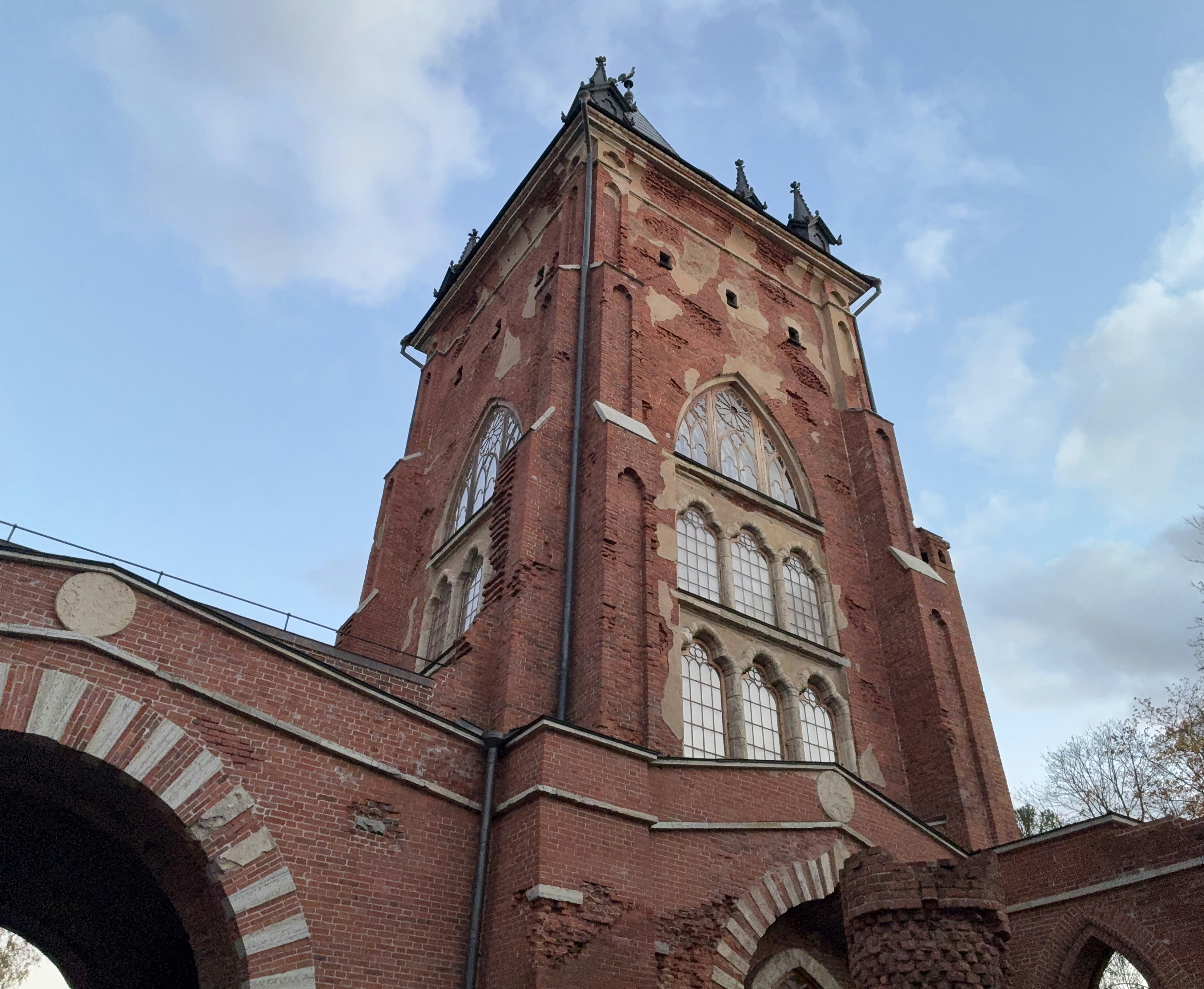 Cathedral Tower Rising from Brick Archway