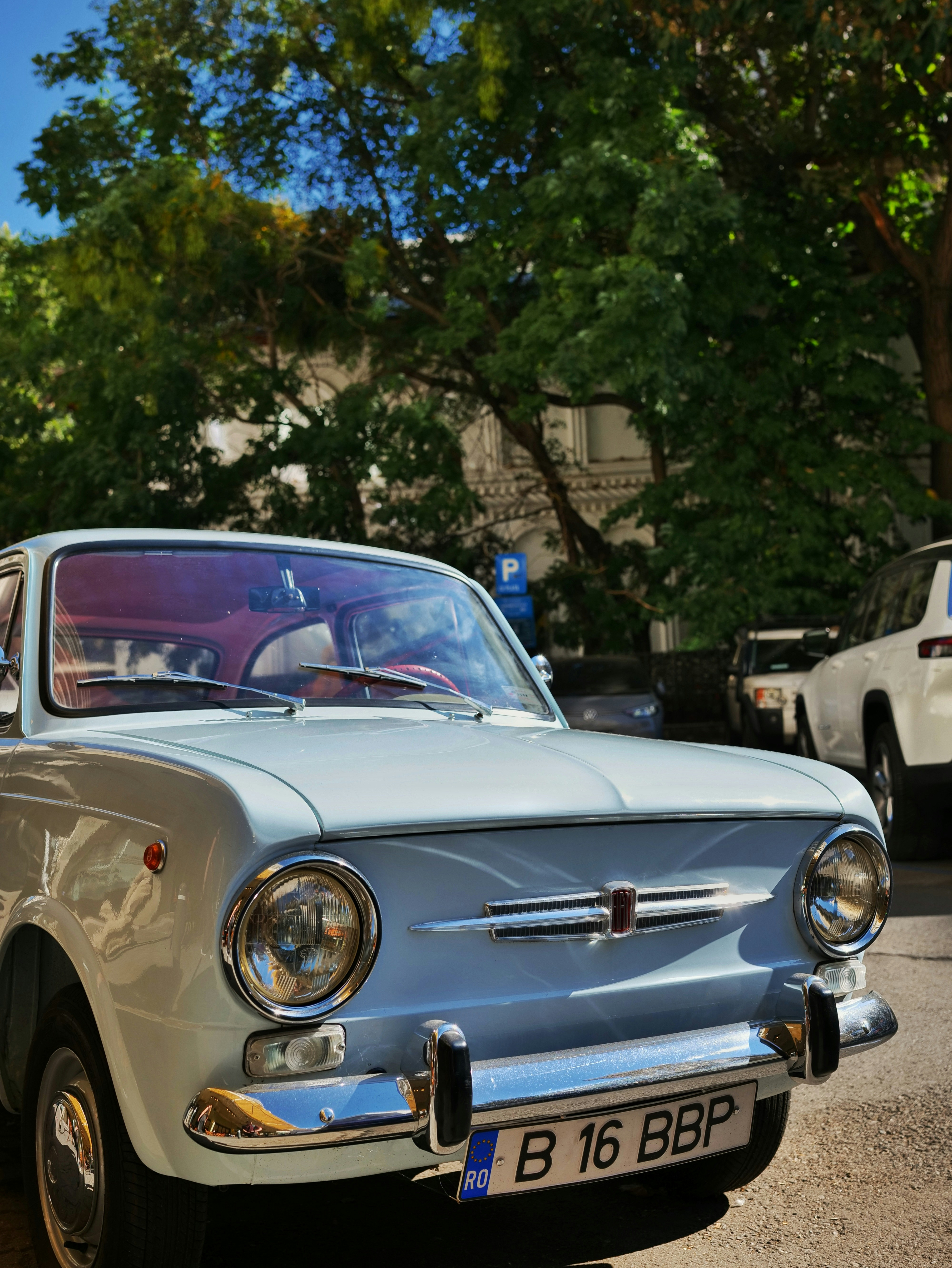 Front-Quarter of a Vintage Fiat Awaits the Sunlight