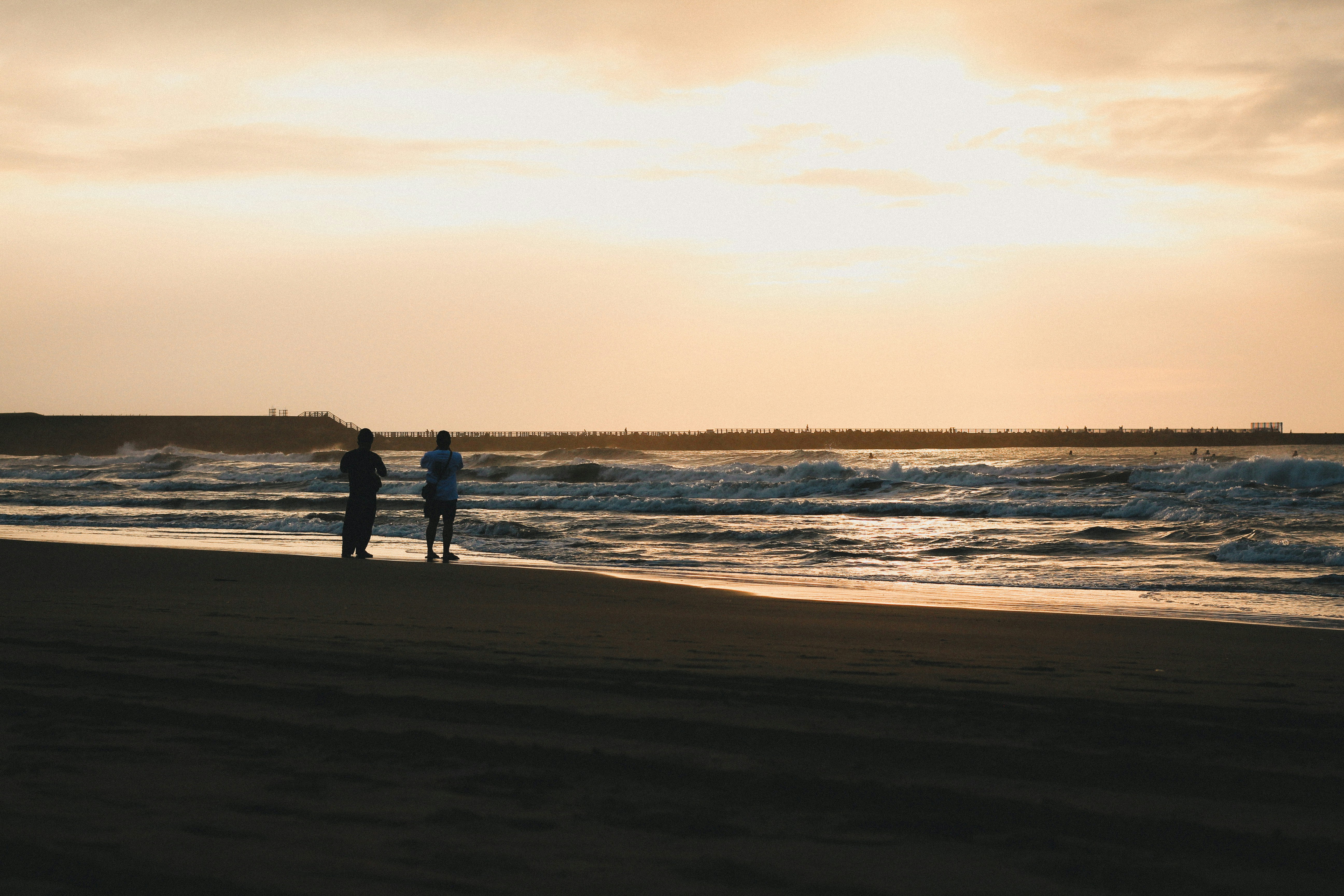 Silhouetted Anglers at Dusk: Quiet Harmony on the Shore
