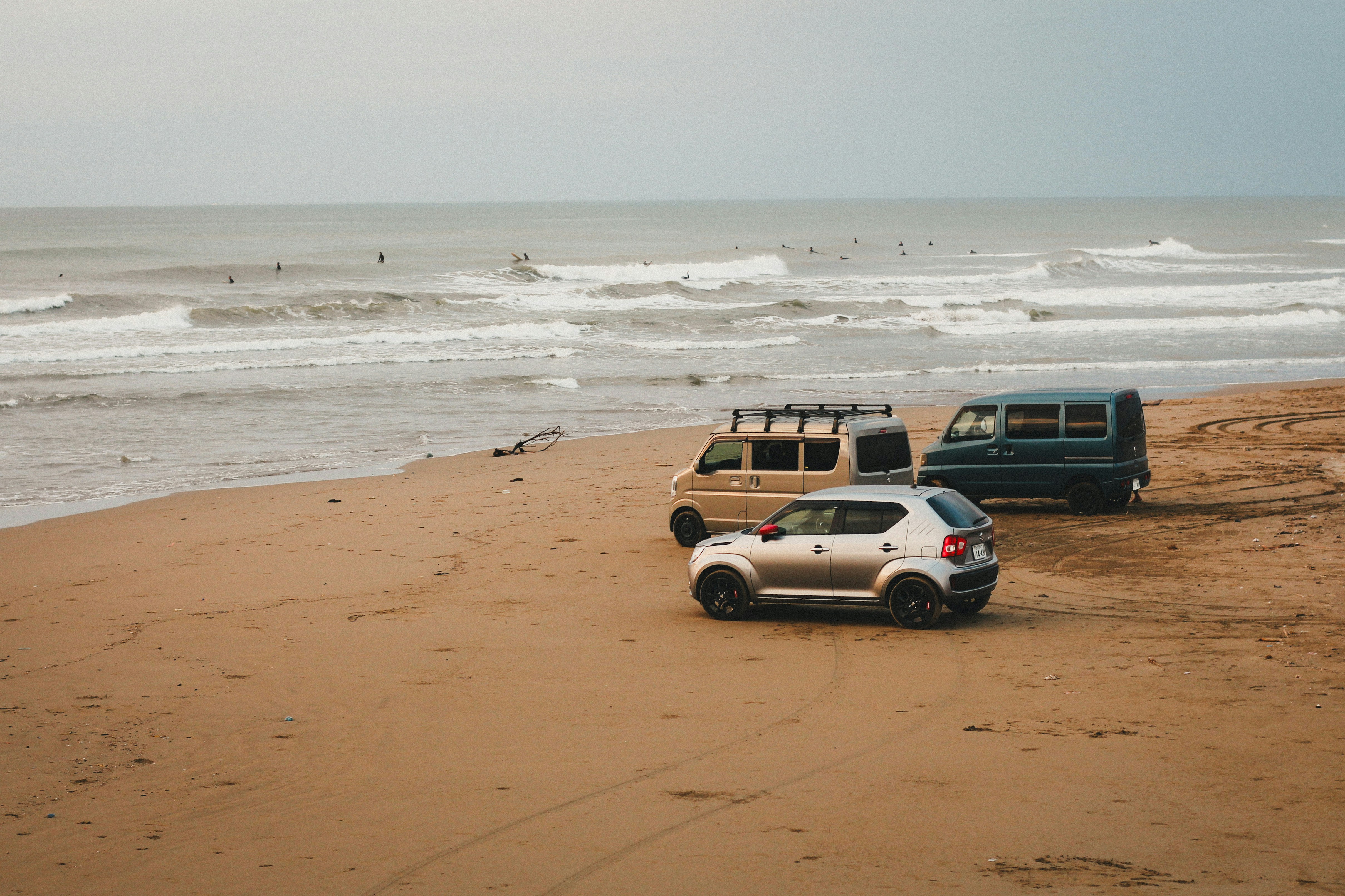 Beachside Car Camp: Three Vehicles at the Tidal Edge