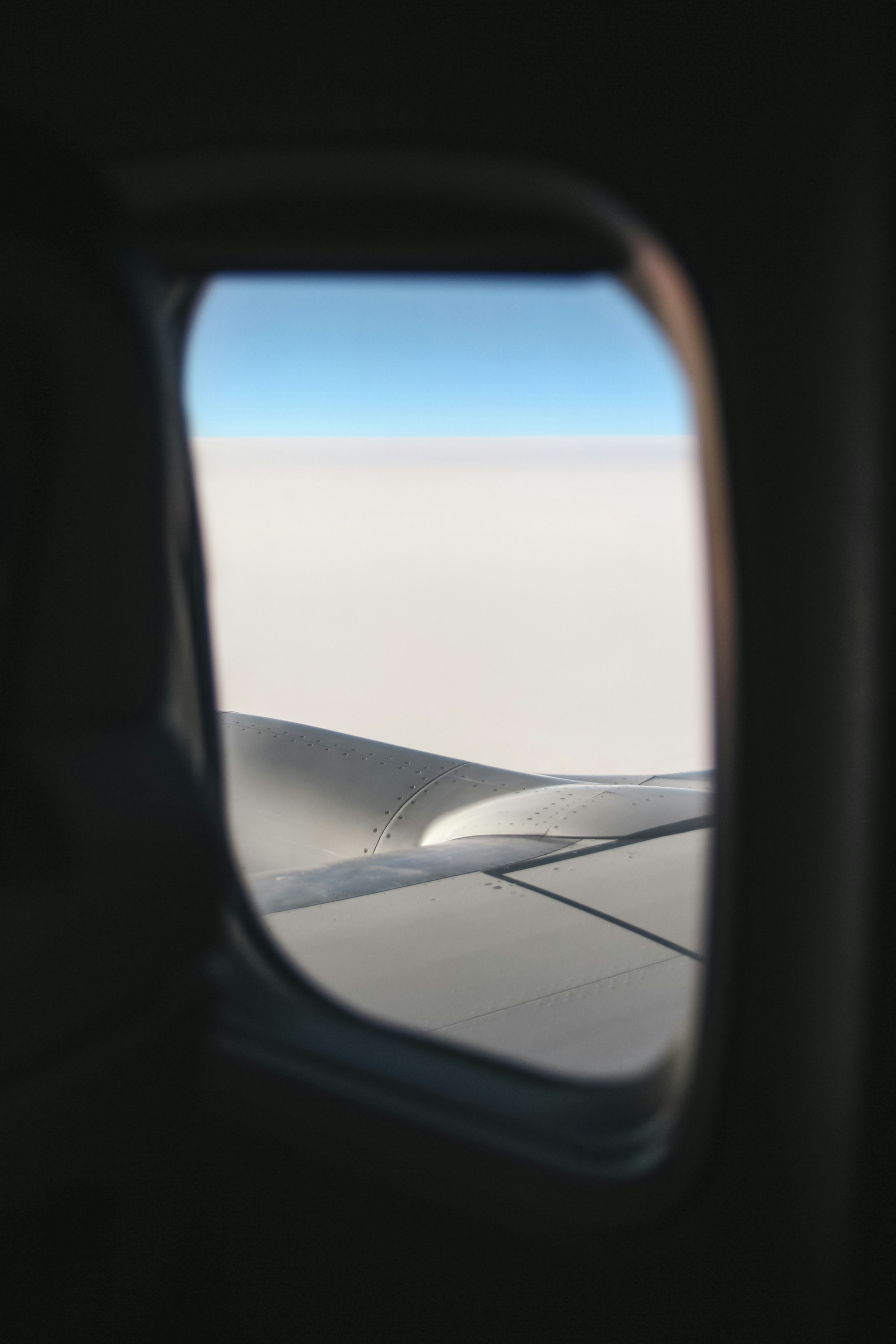 Window to the Sky: Wing View Through the Cabin Frame