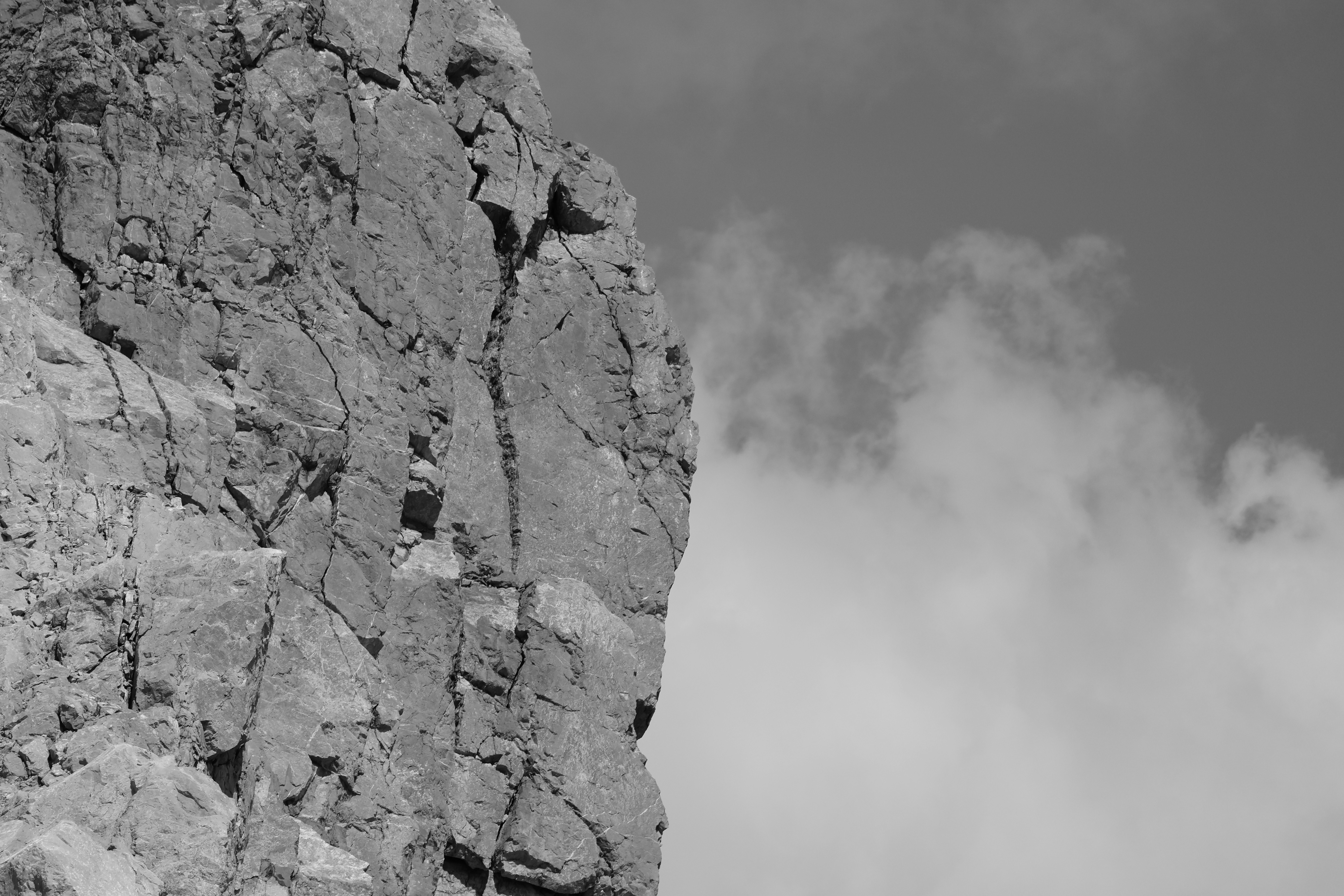 Steep Granite Edge Against a Quiet Sky