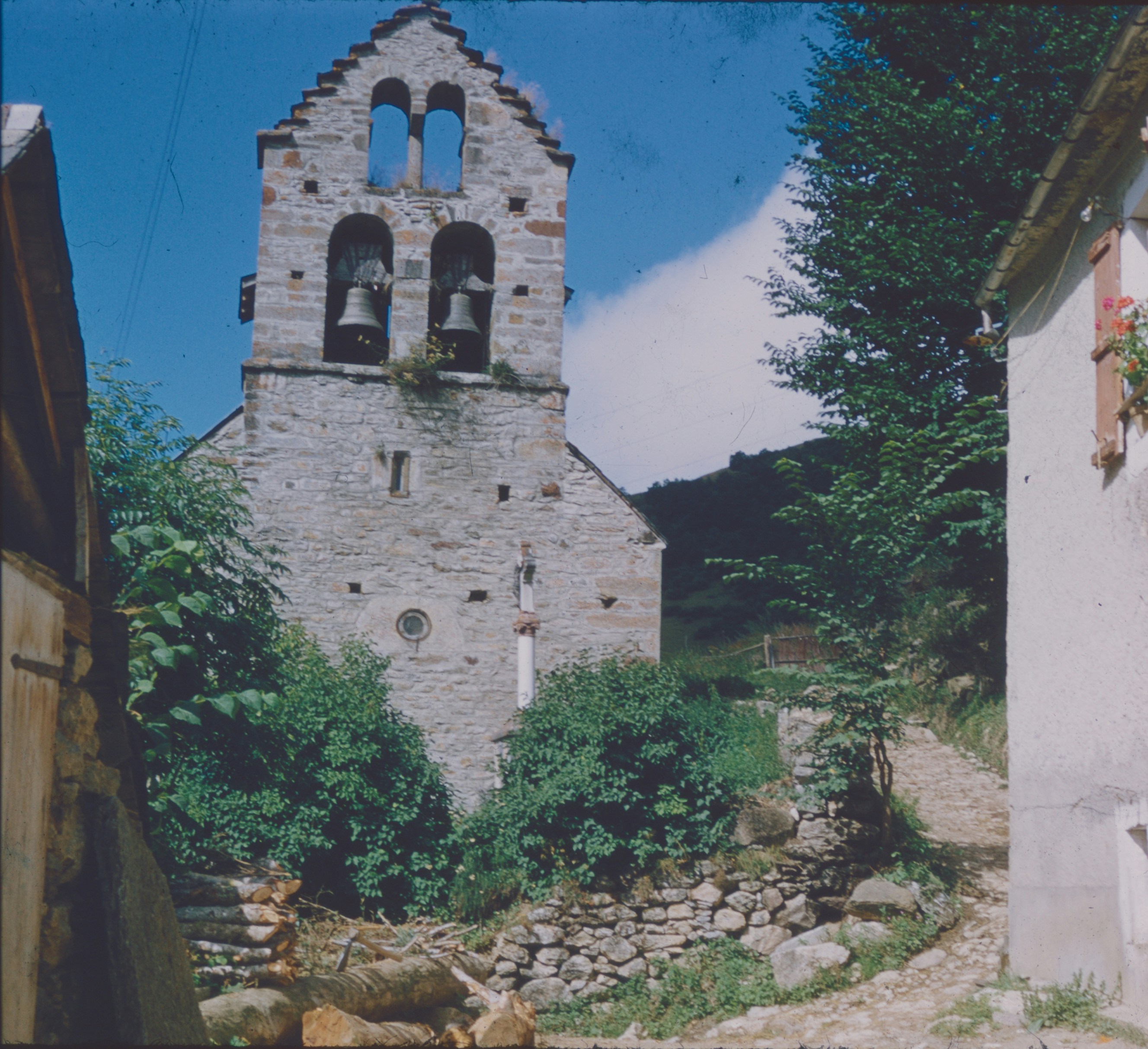 Stone Bell Tower Aligned with Sunlit Path