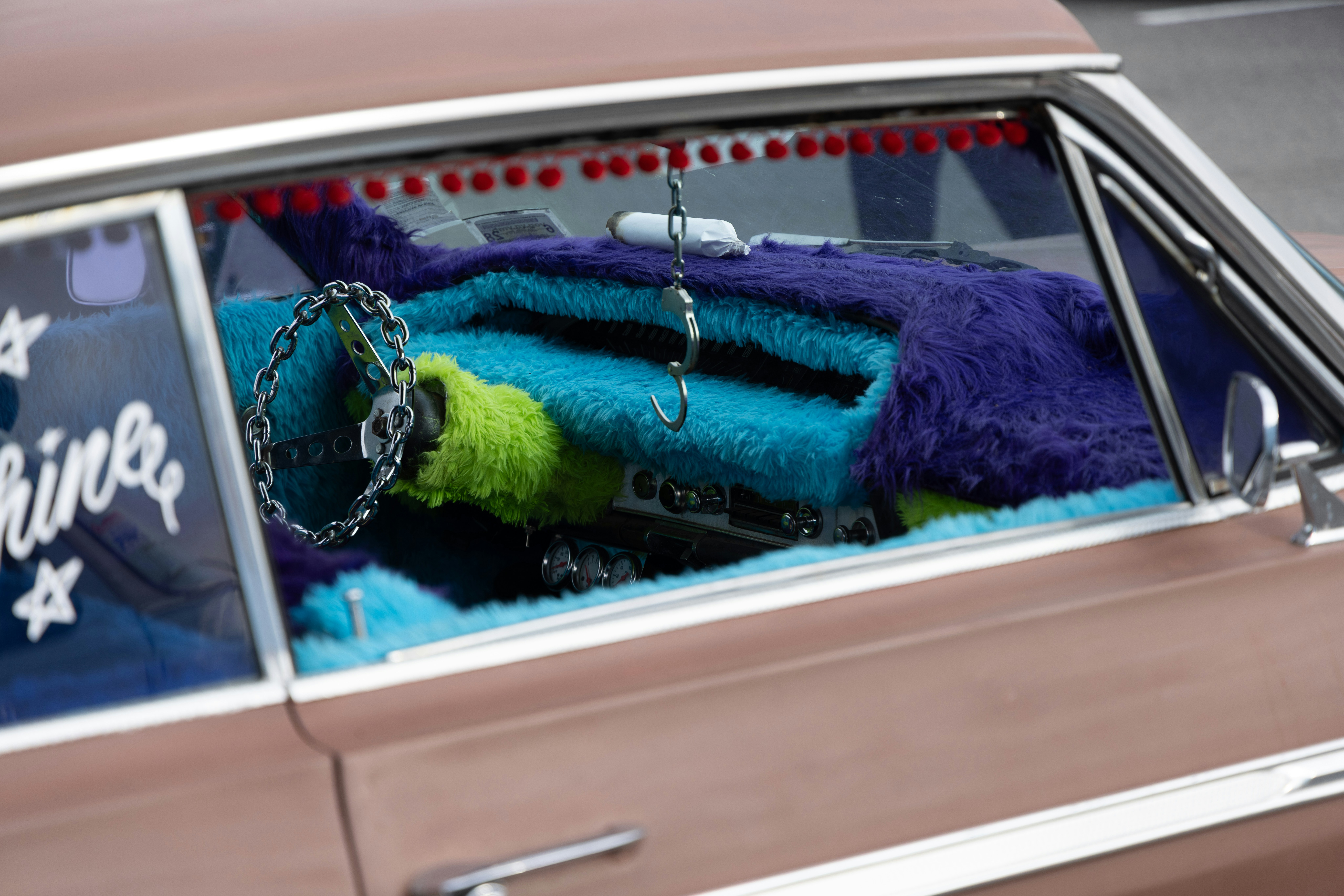 Turbo Fur Car Comfort: Inside a Vintage Sedan's Colorful Cabin