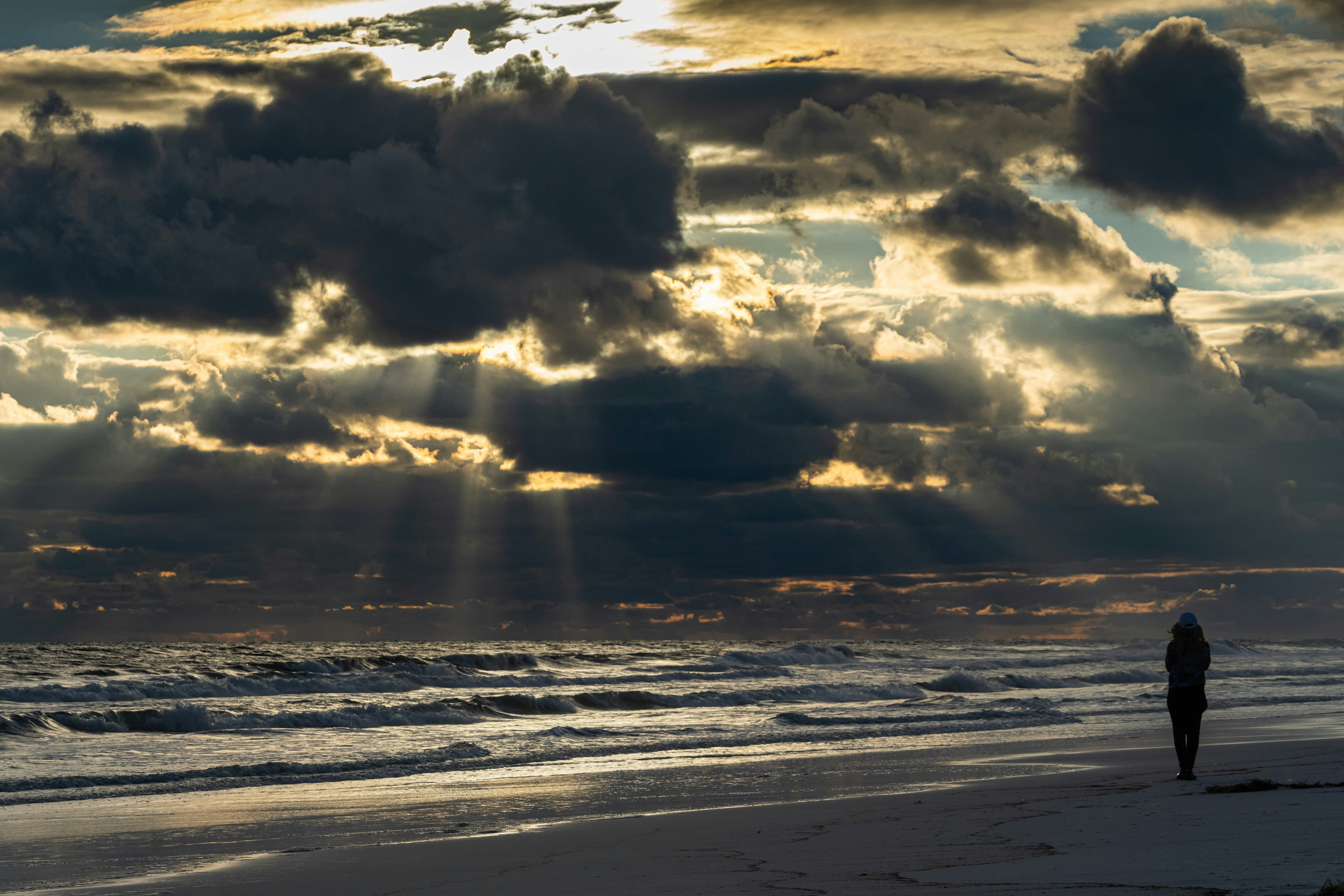 Solitary Figure Beneath A Split Sky at Dusk