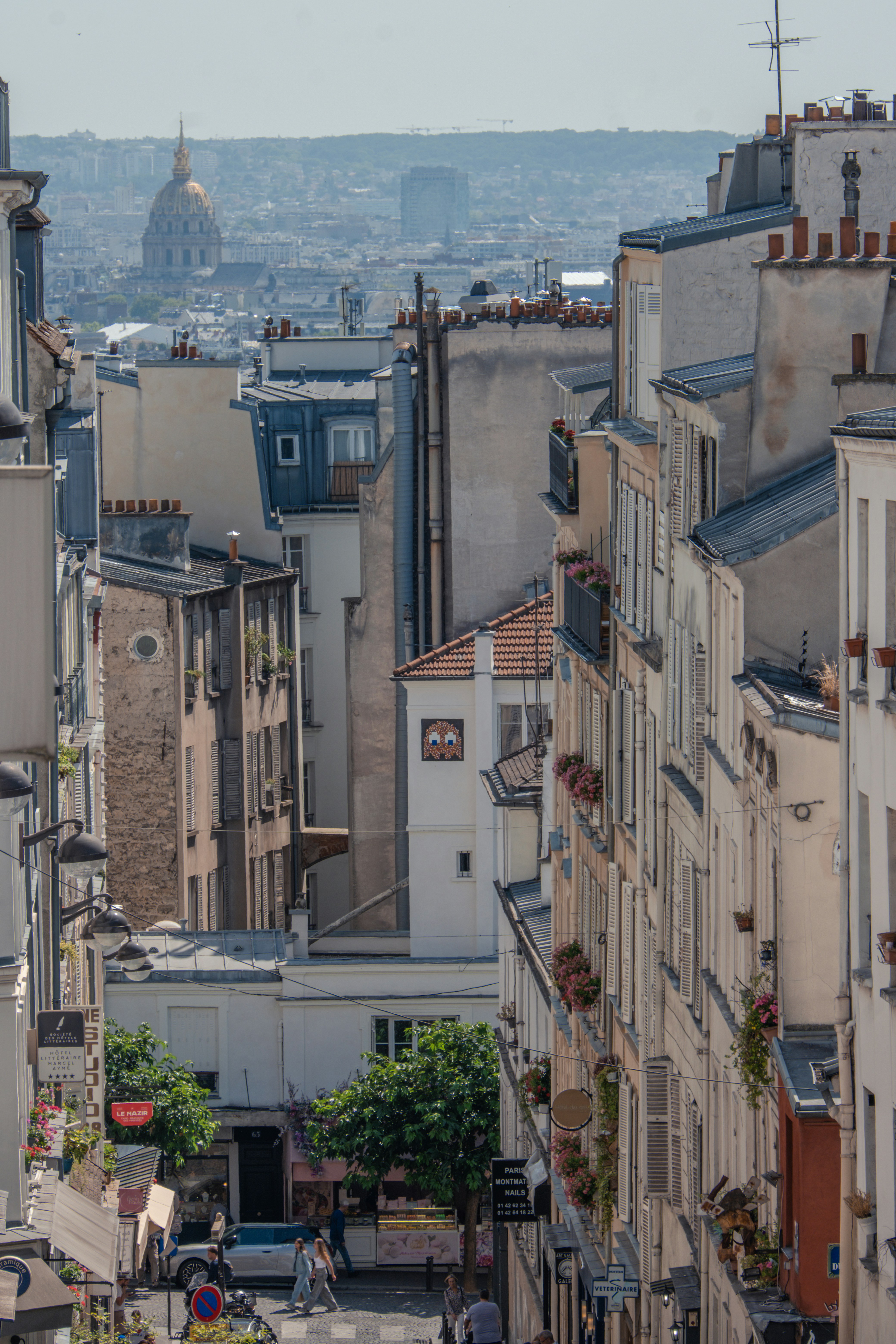 Parisian Rooftops: A Narrow Lane Leading to Montmartre’s Skyline