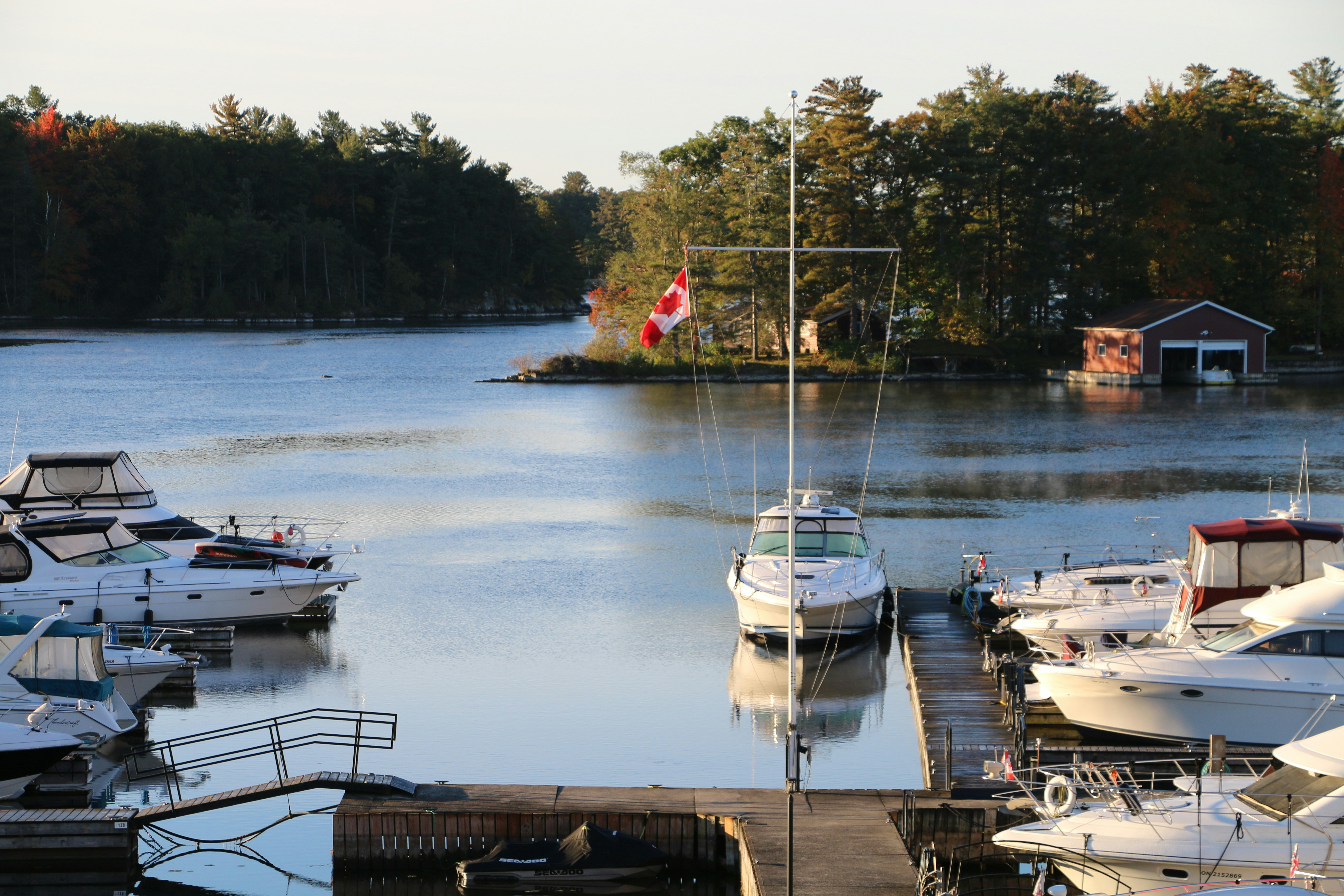 Canada Rouge at Dockside: Boats, Water, and a Quiet Lakeside Moment