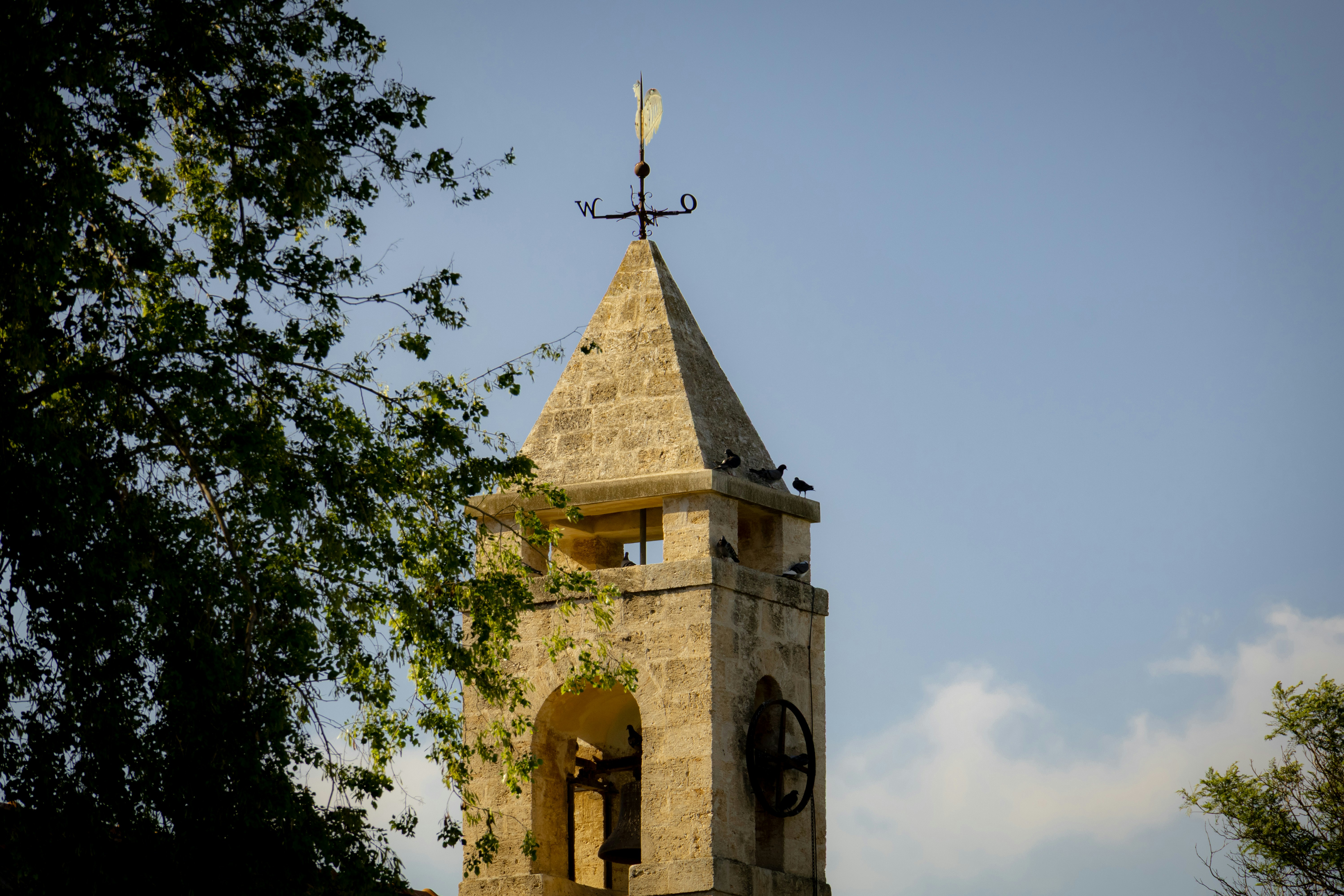 Stone Bell Tower Reaching Toward a Clear Sky