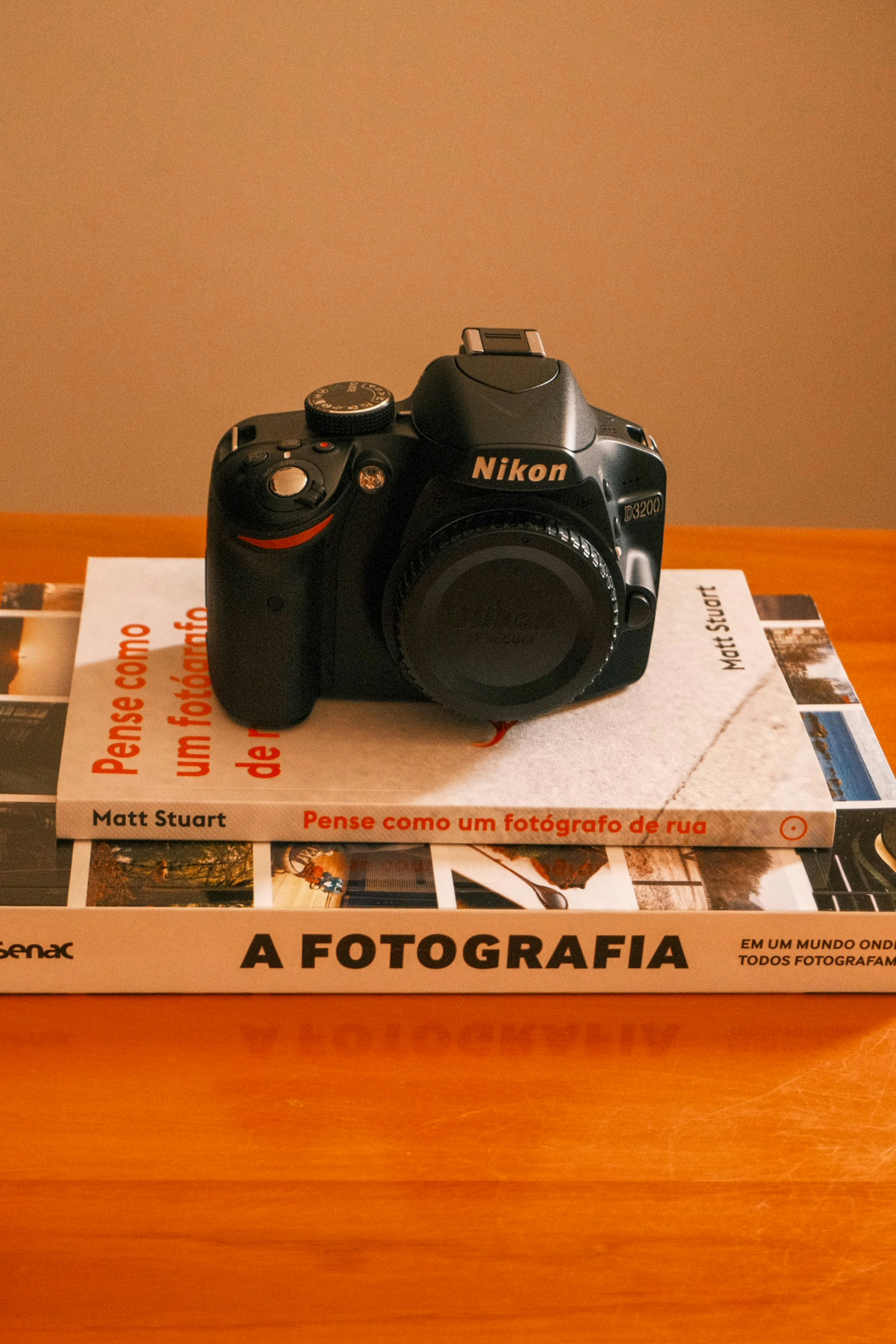 Nikon on a Quiet Stack: An Everyday Desk Moment