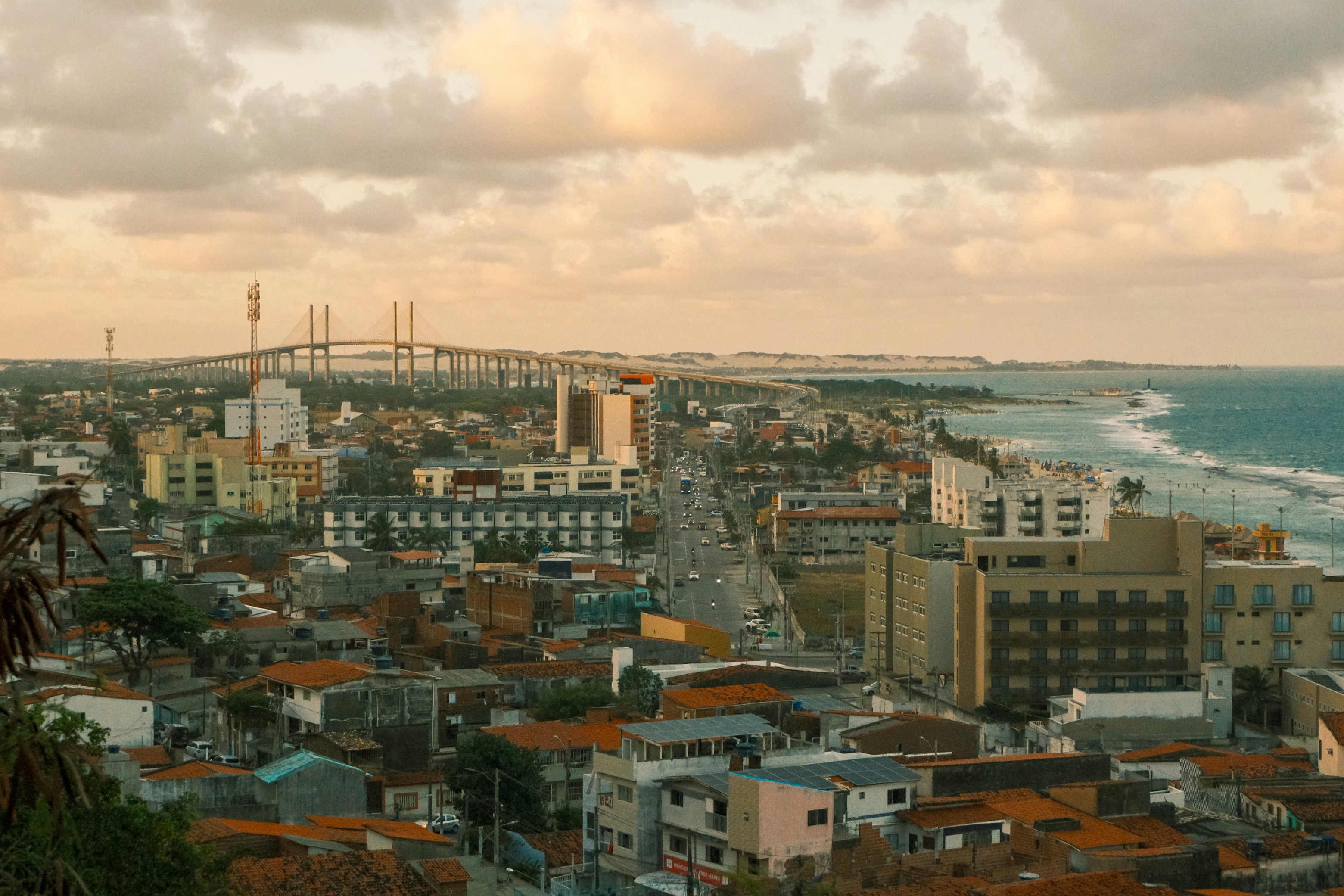 Coastal Cityscape: A Sunlit Evening Over a Bustling Seaboard Neighborhood