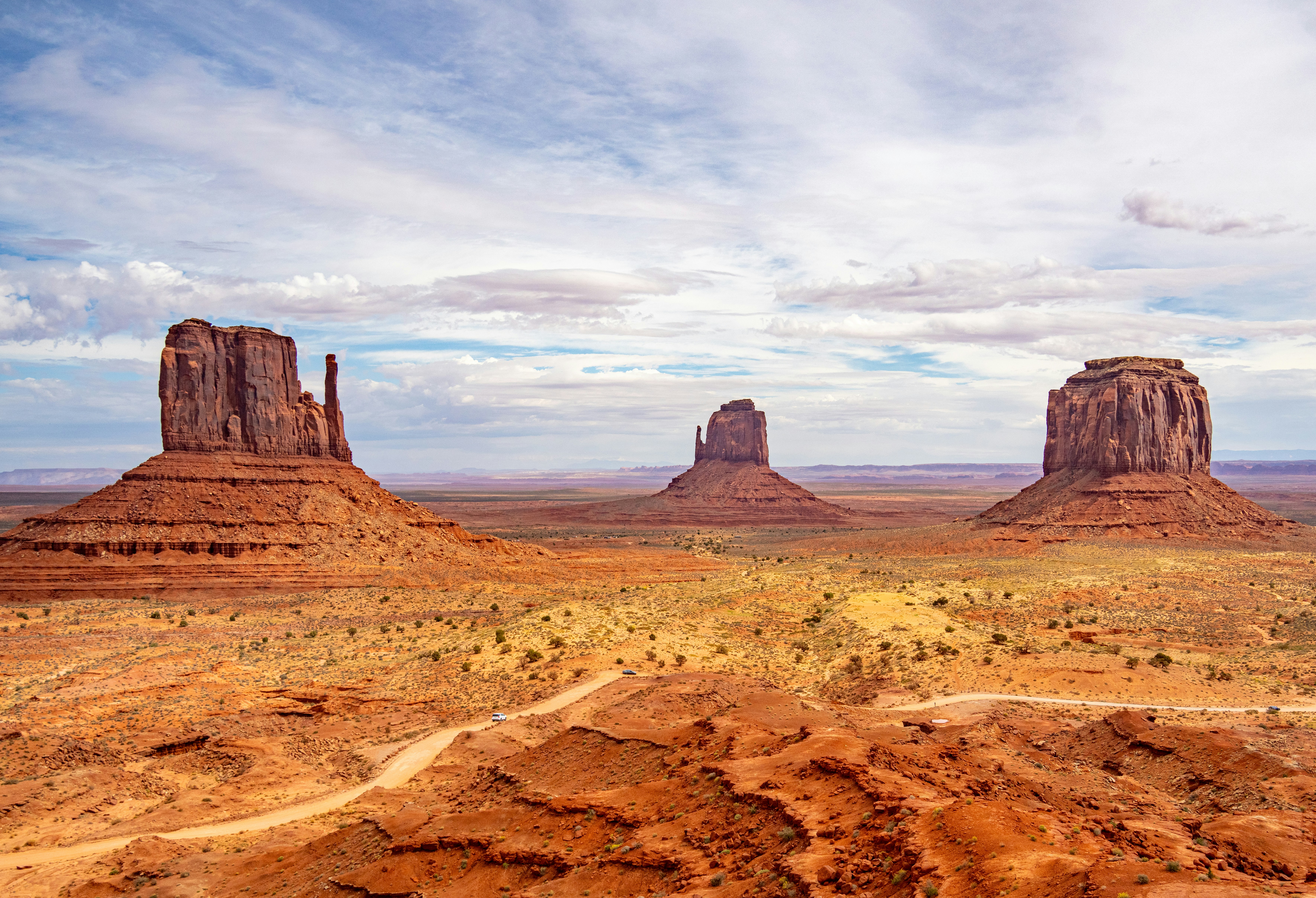 Three Sandstone Sentinels Over a Desert Wold